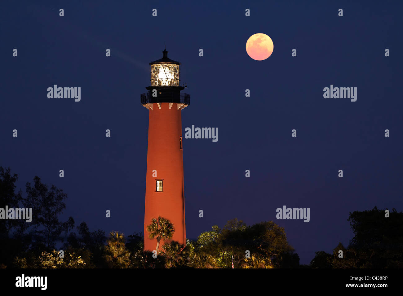Jupiter Inlet Lighthouse with a full moon Stock Photo - Alamy