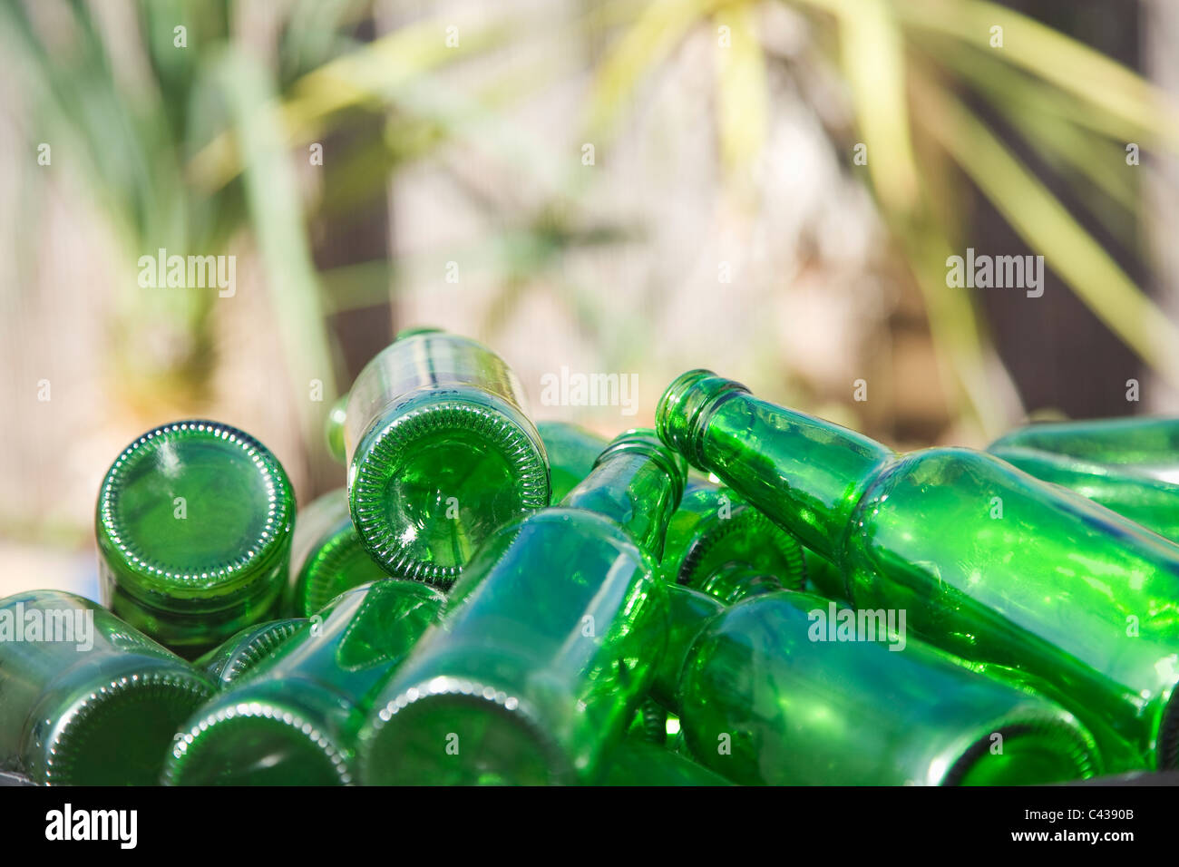 household recycling of green glass bottles Stock Photo - Alamy