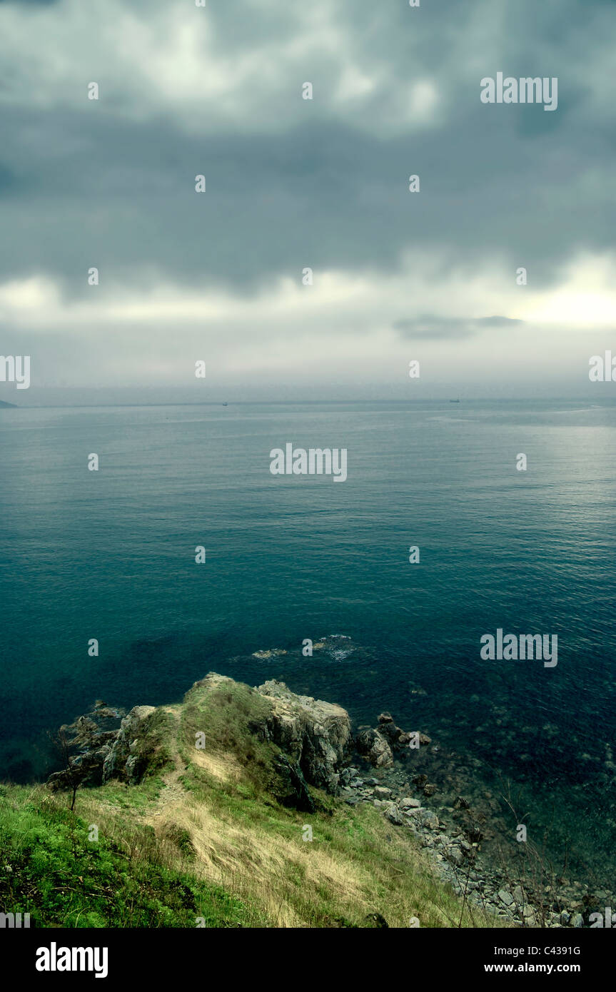 Dark island in sea hi-res stock photography and images - Alamy