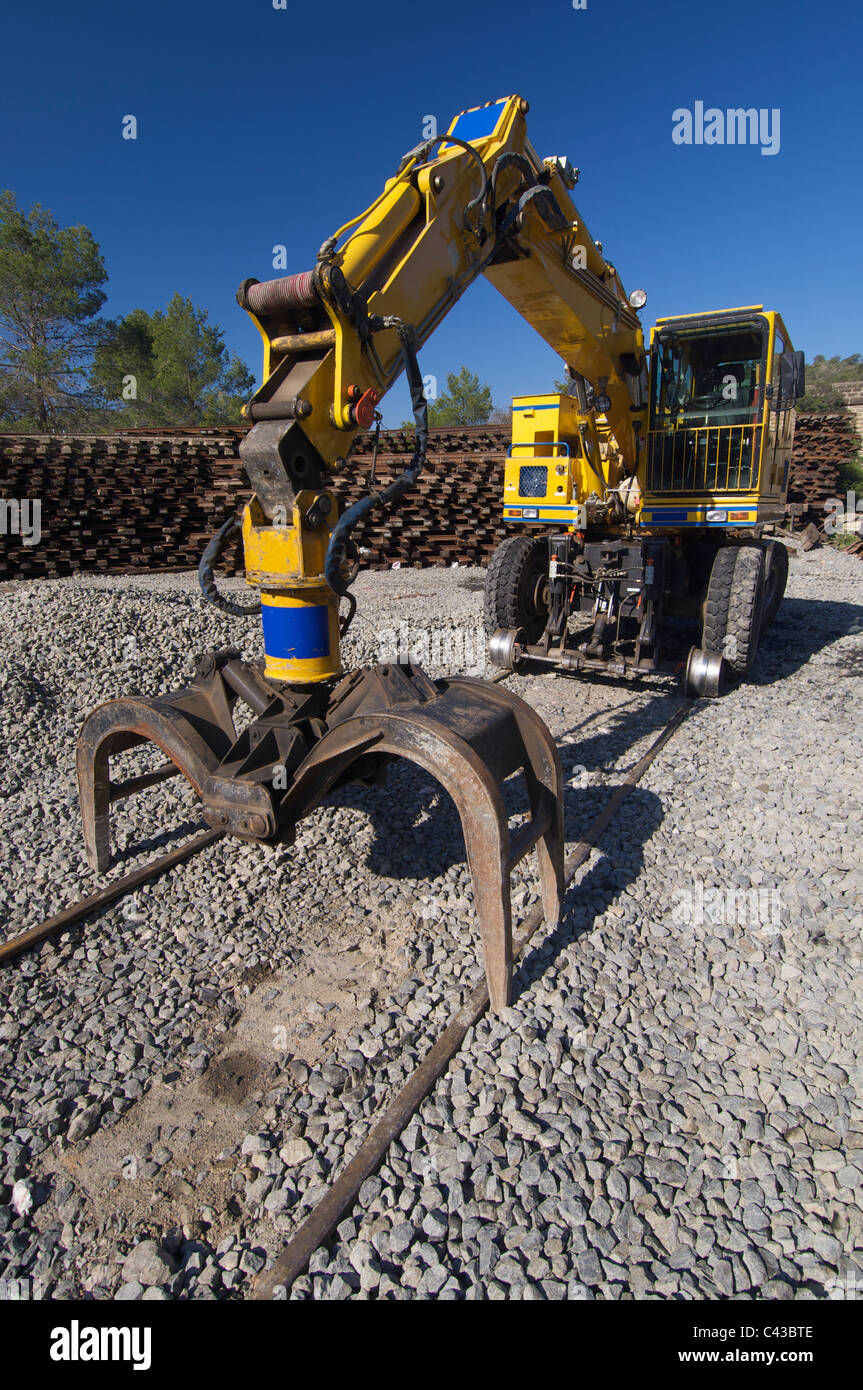 Yellow machine repair train tracks hi-res stock photography and images ...