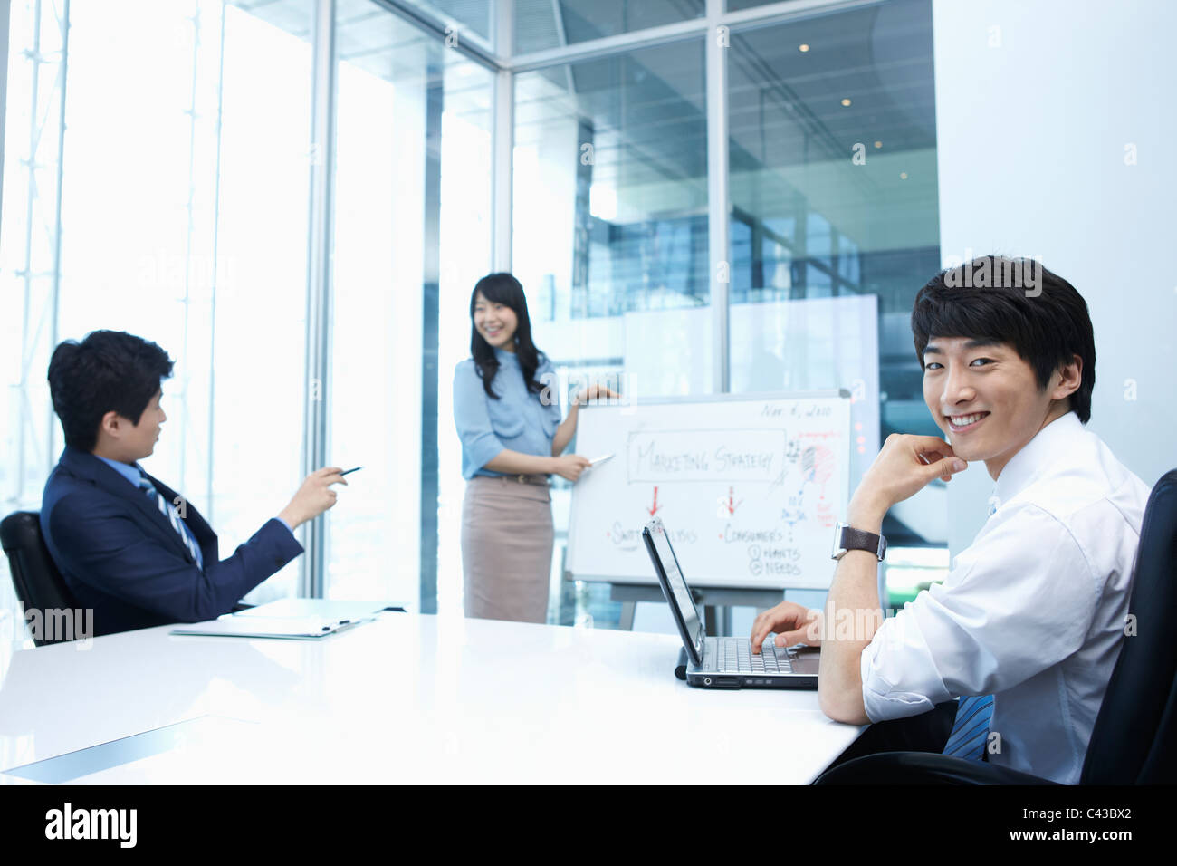 woman doing presentation to people in meeting room Stock Photo - Alamy
