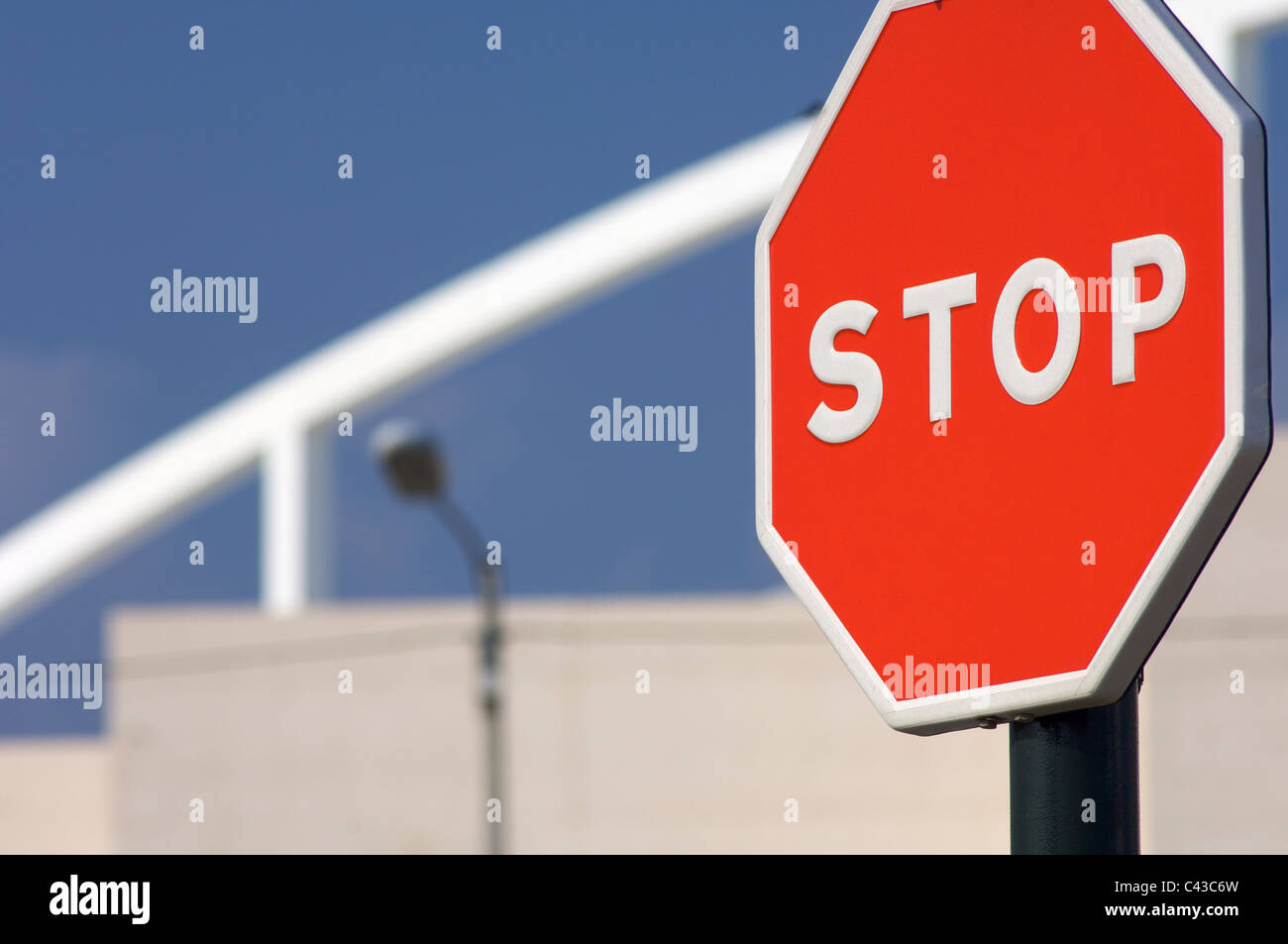red stop sign in town Stock Photo - Alamy