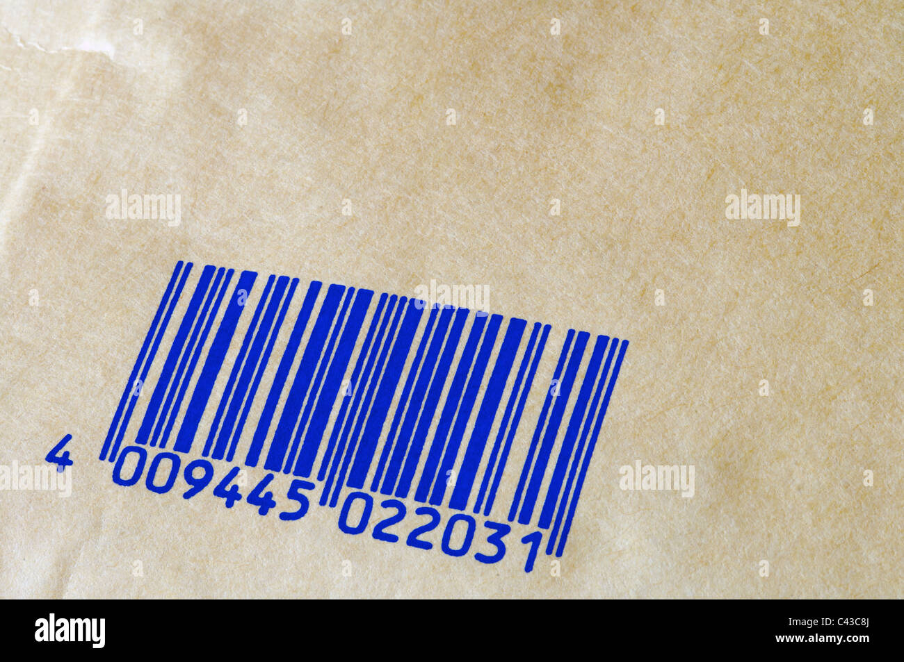 barcode printed in blue on a brown Stock Photo - Alamy