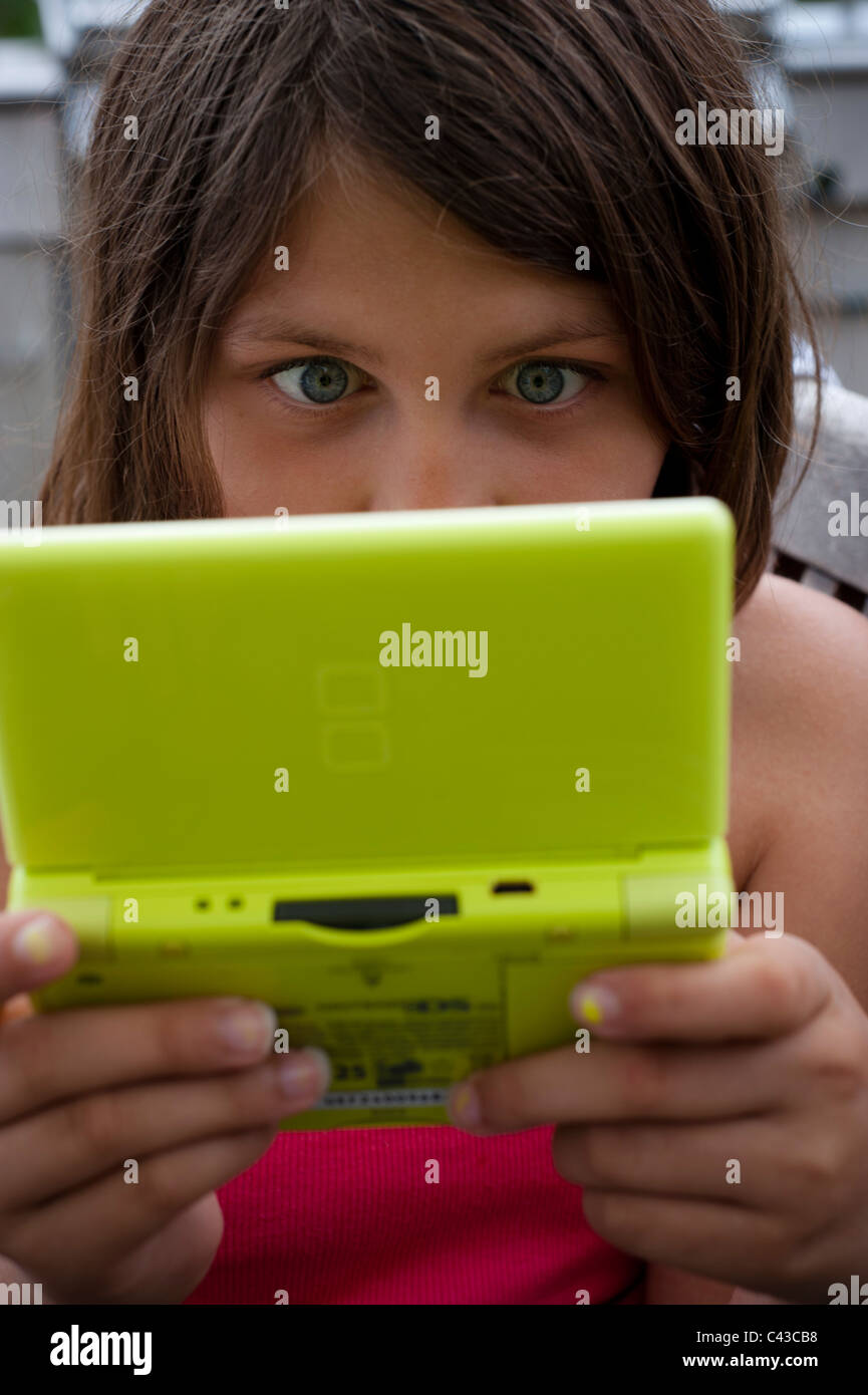 Girl playing nintendo Stock Photo - Alamy