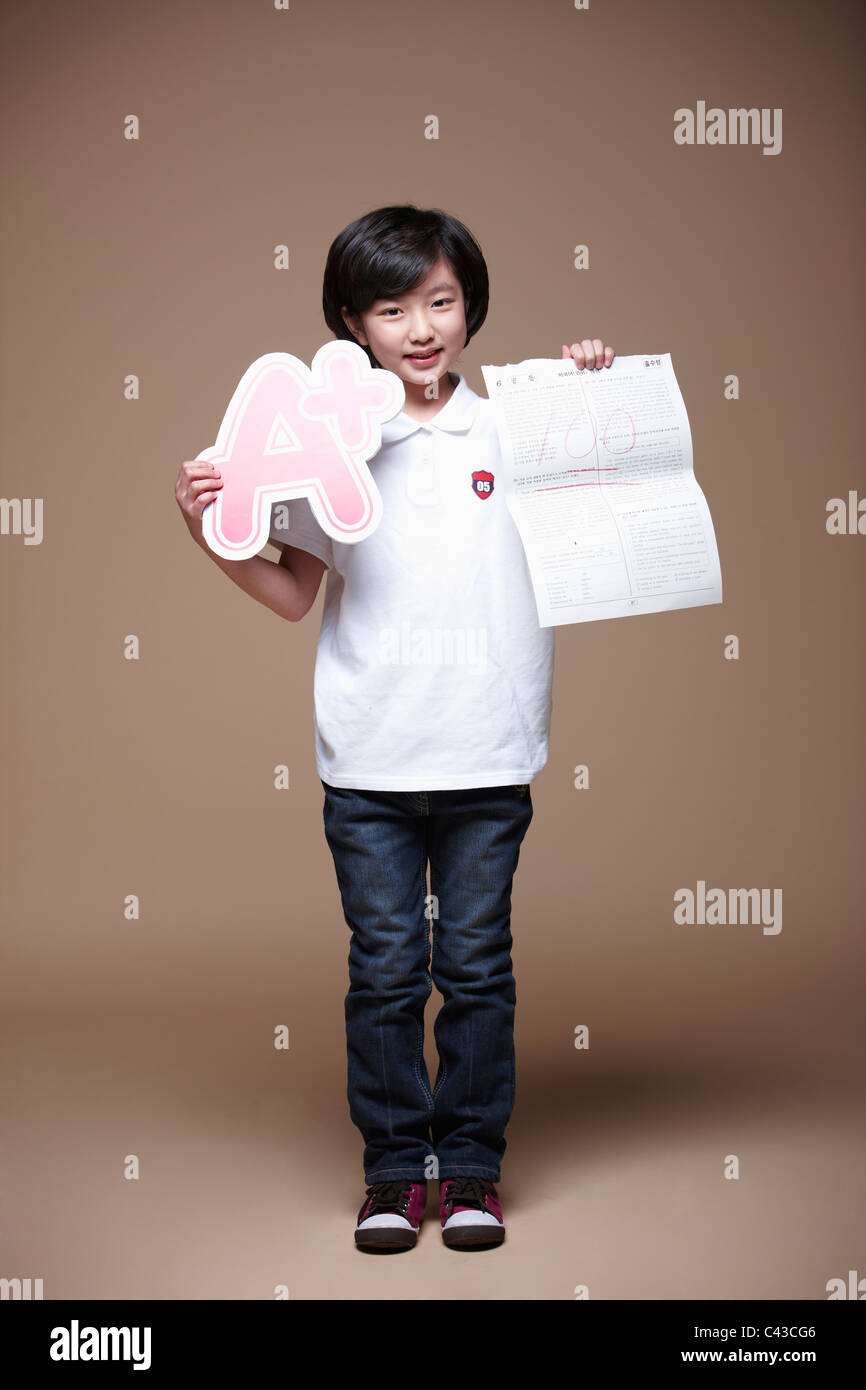 girl get a plus grade Stock Photo - Alamy