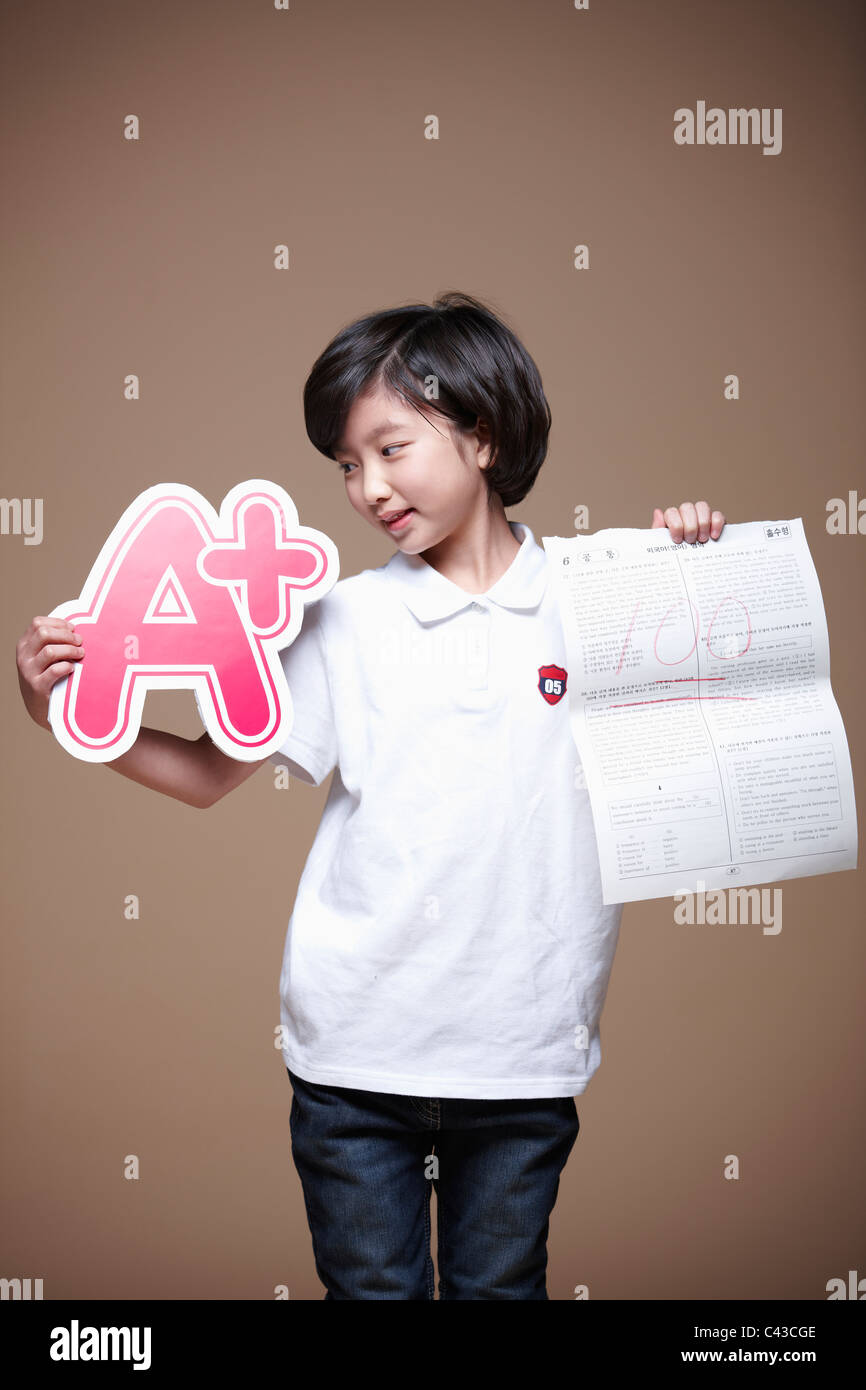 girl get a plus grade Stock Photo - Alamy
