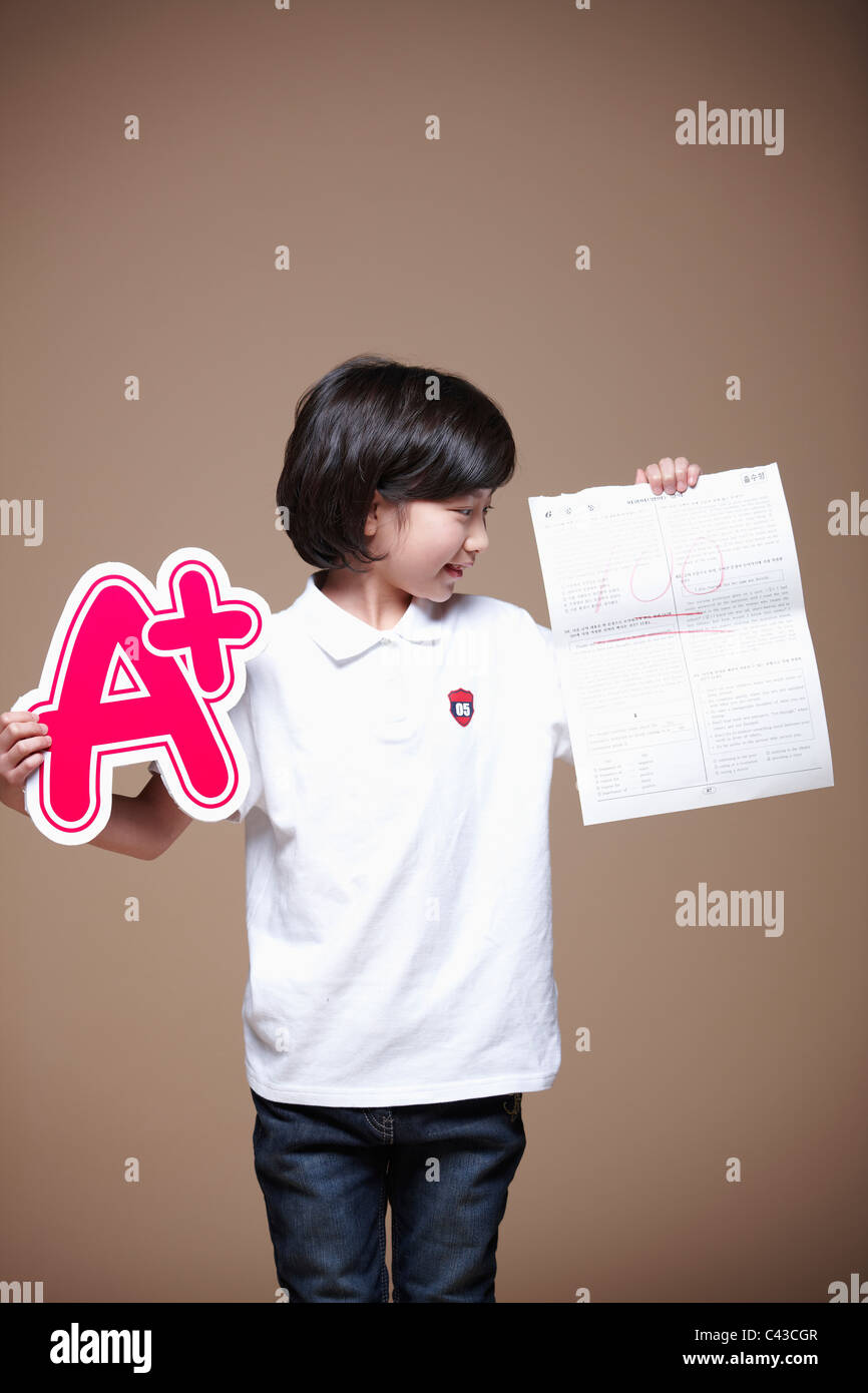 girl get a plus grade Stock Photo - Alamy