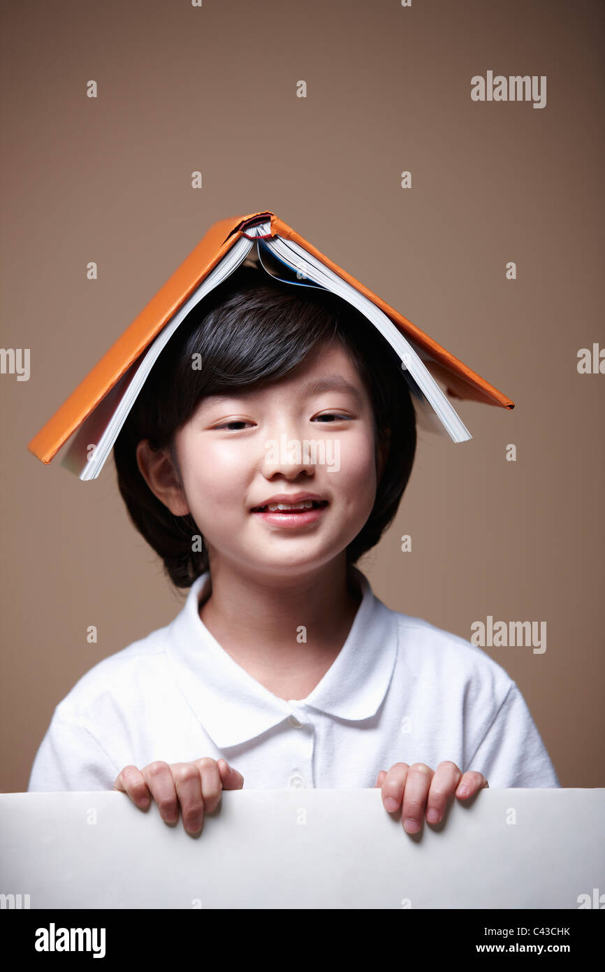 girl balancing a book on her head Stock Photo - Alamy
