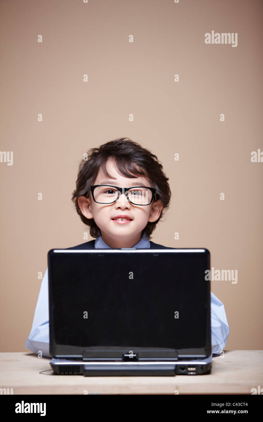 boy is studying using laptop Stock Photo - Alamy