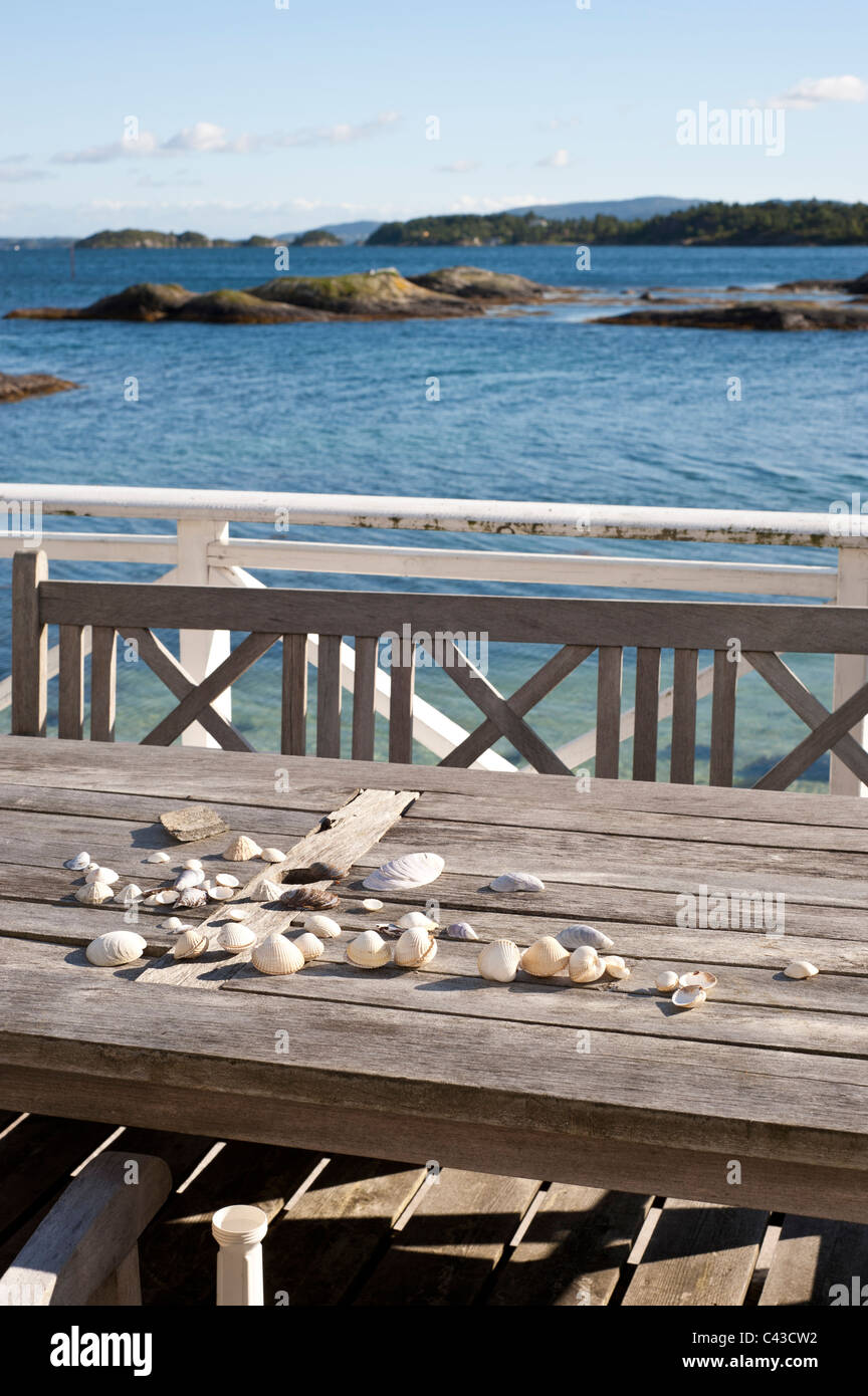 Shells on porch table Stock Photo - Alamy
