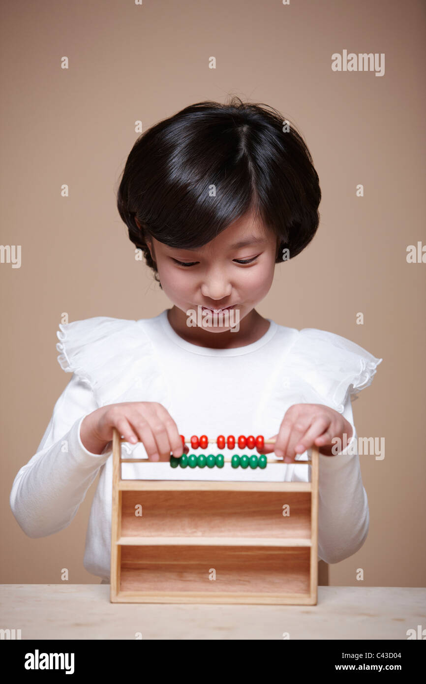 Woman using abacus hi-res stock photography and images - Alamy