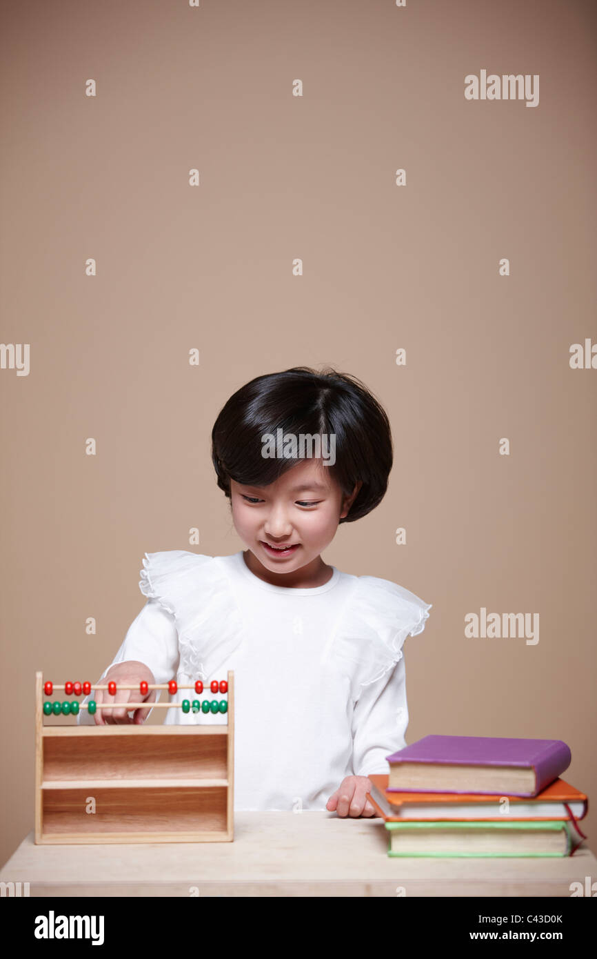 Woman using abacus hi-res stock photography and images - Alamy
