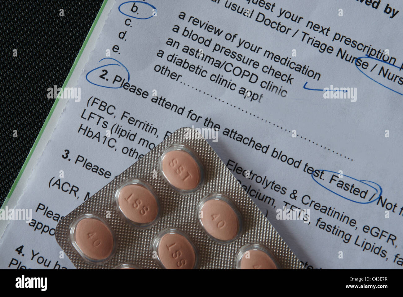 Blood test notification and statin tablets Stock Photo - Alamy