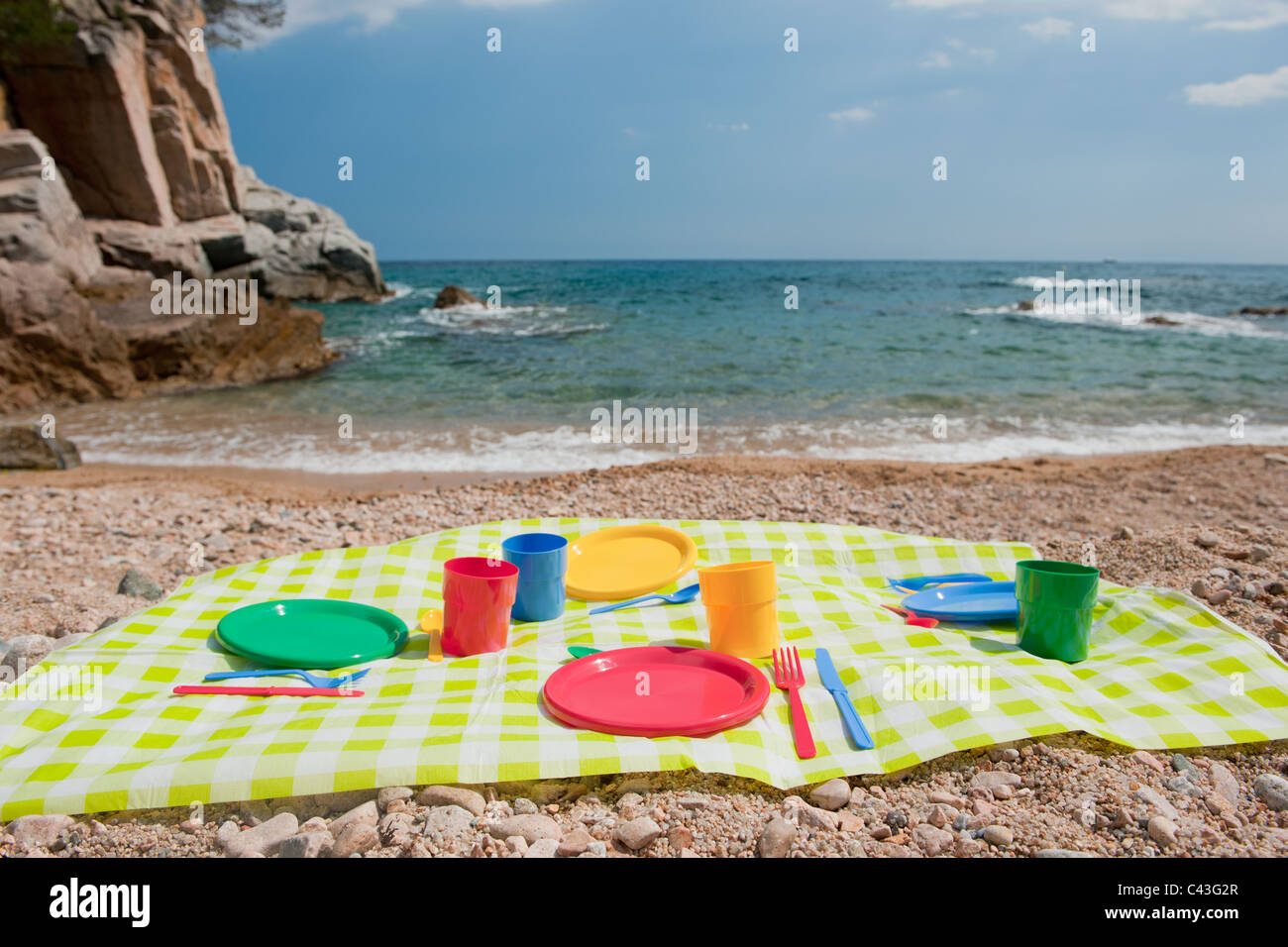 picnic with colorful plastic crockery at the beach Stock Photo - Alamy