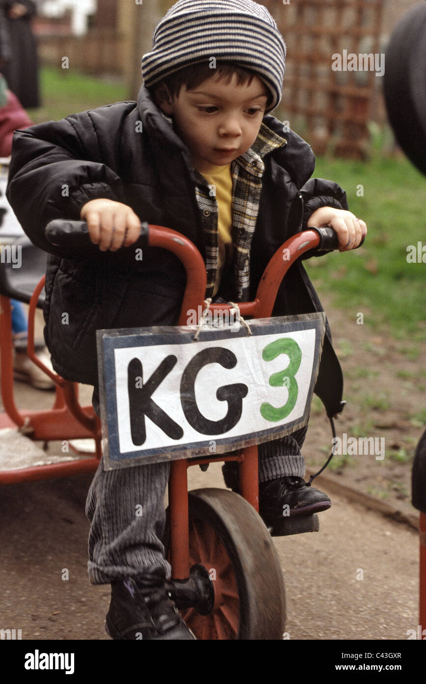 Boy riding a tricycle hi-res stock photography and images - Alamy