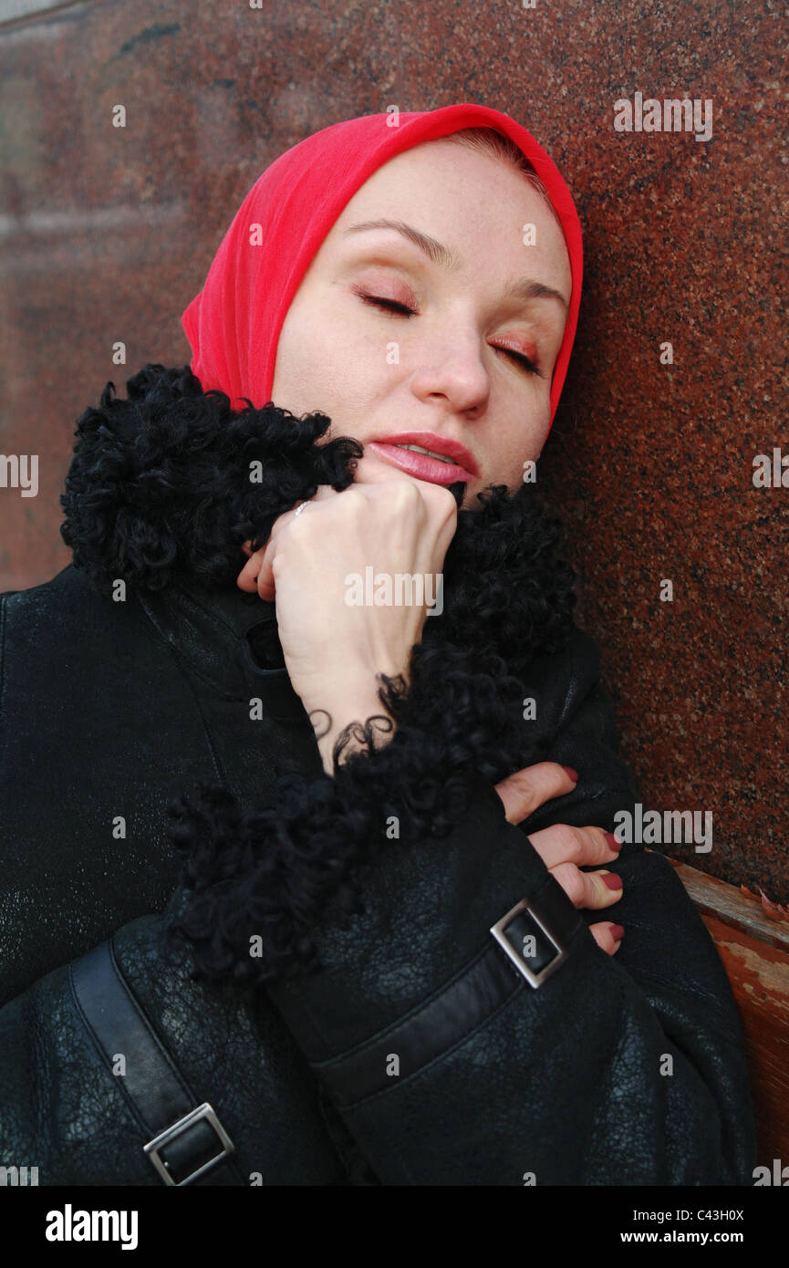 Sad girl in red scarf hi-res stock photography and images - Alamy