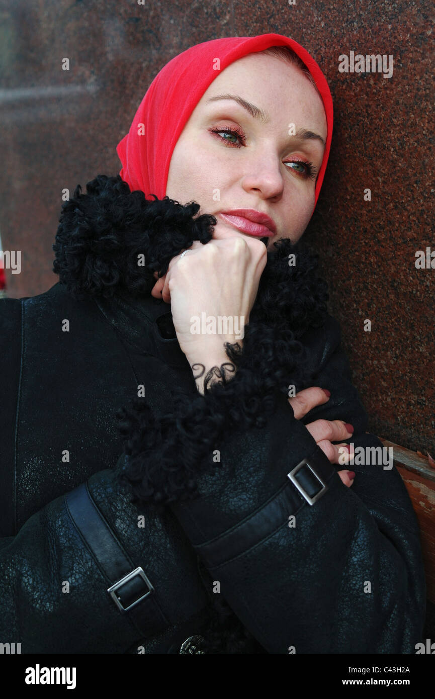 Sad girl in red scarf hi-res stock photography and images - Alamy
