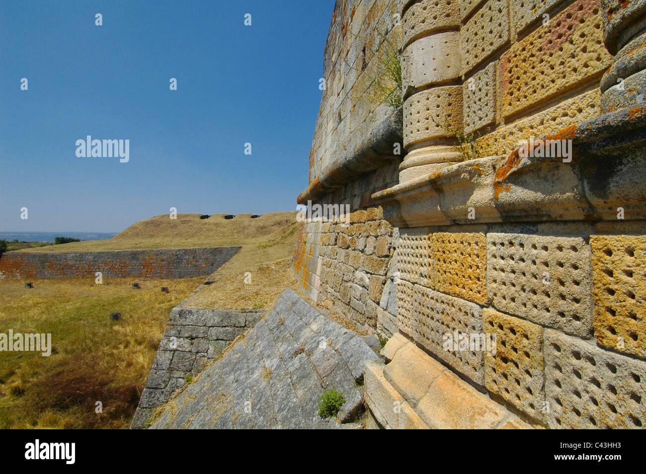 Massive wall of the 16th century castle in the fortified village of ...