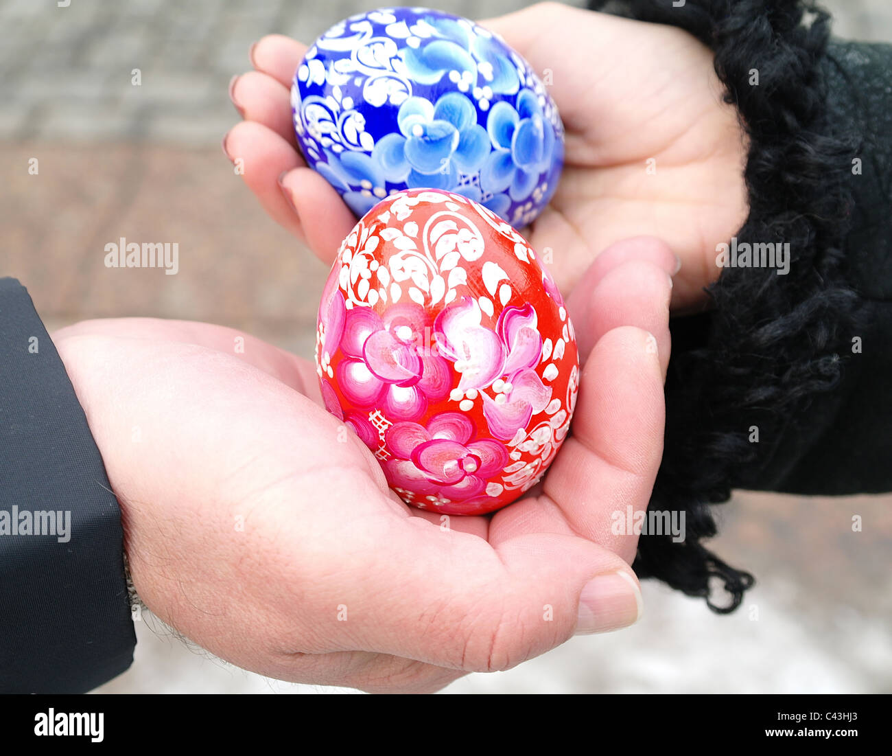 Easter eggs in man's and female hands, Moscow, Russia Stock Photo - Alamy