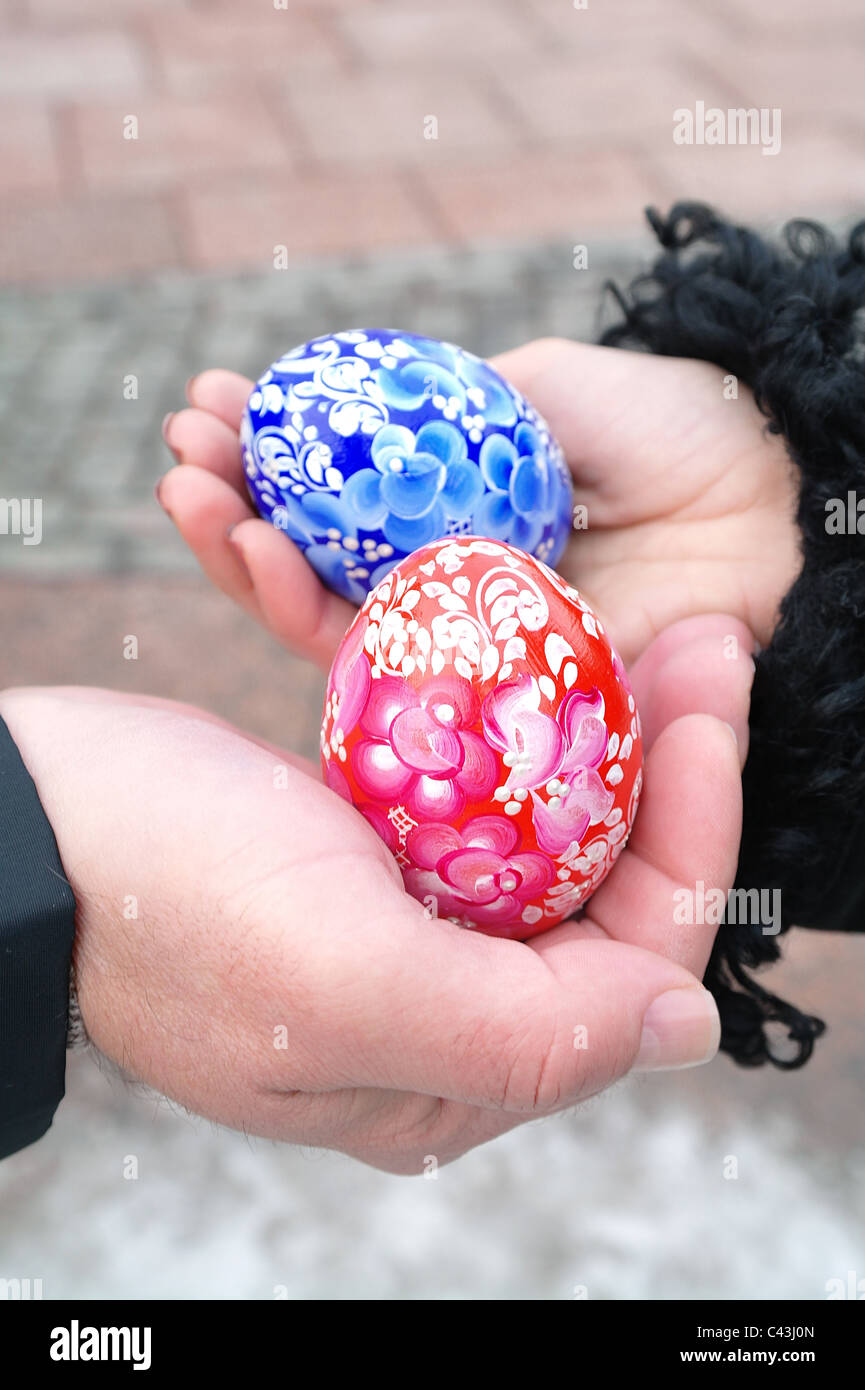Easter eggs in man's and female hands, Moscow, Russia Stock Photo - Alamy