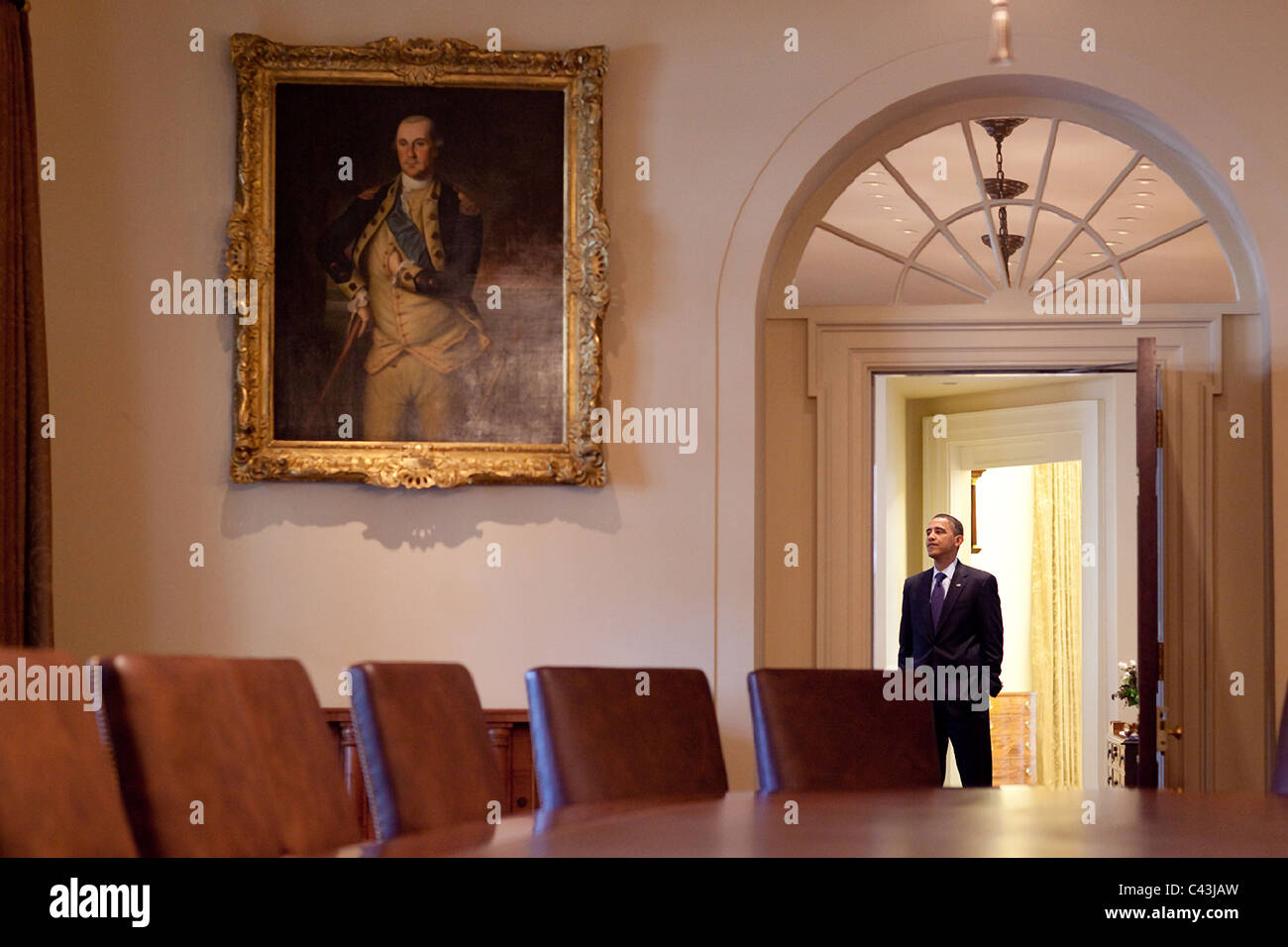 President Barack Obama stands in the Outer Oval Office, viewed from the ...