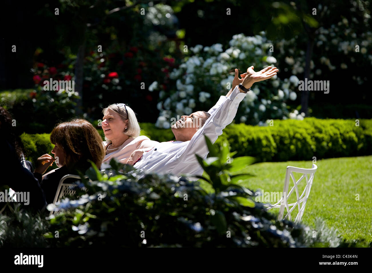 President Barack Obama stretches in the afternoon sun after moving his ...
