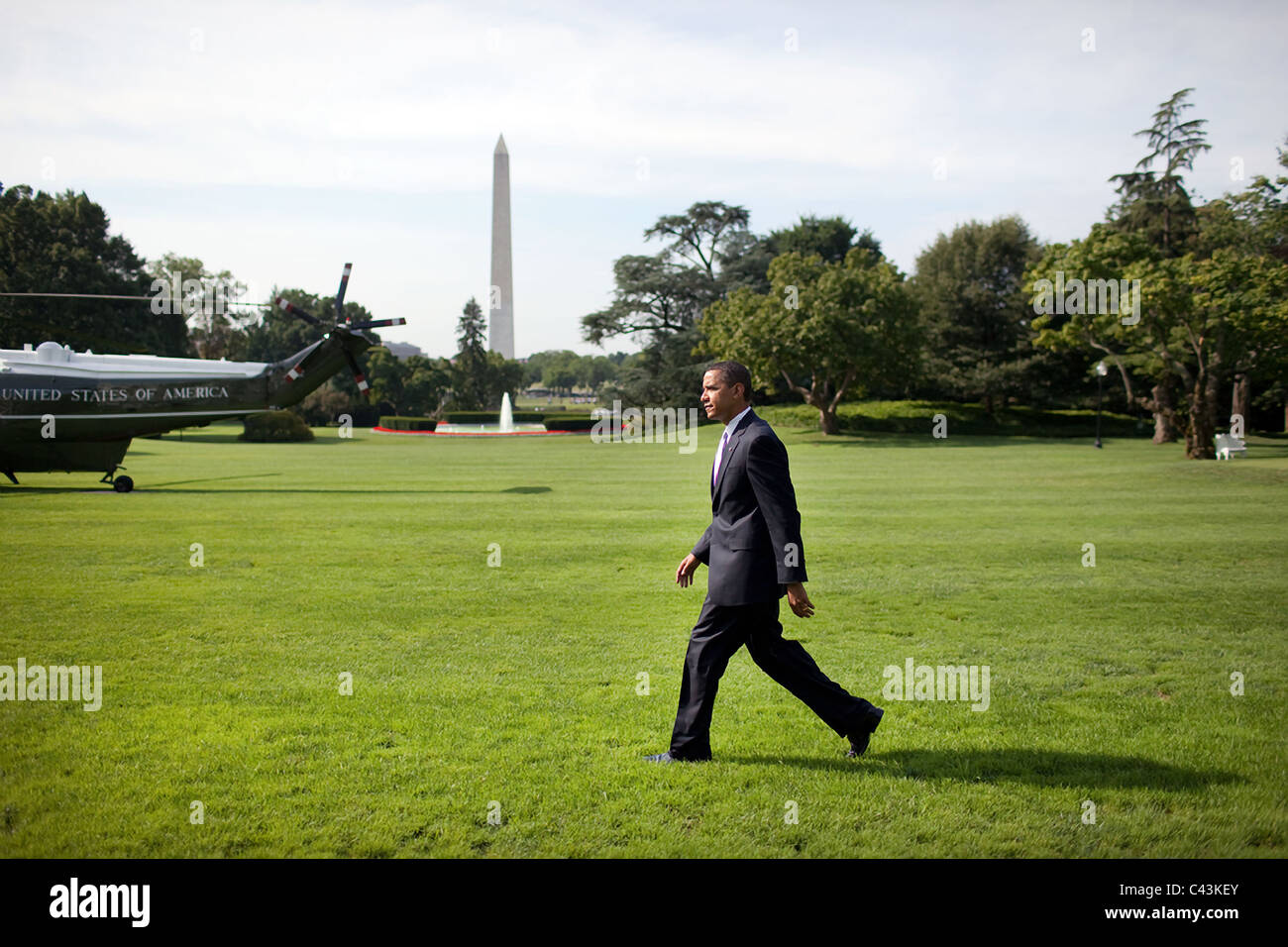President Barack Obama walks across the South Lawn of the White House ...