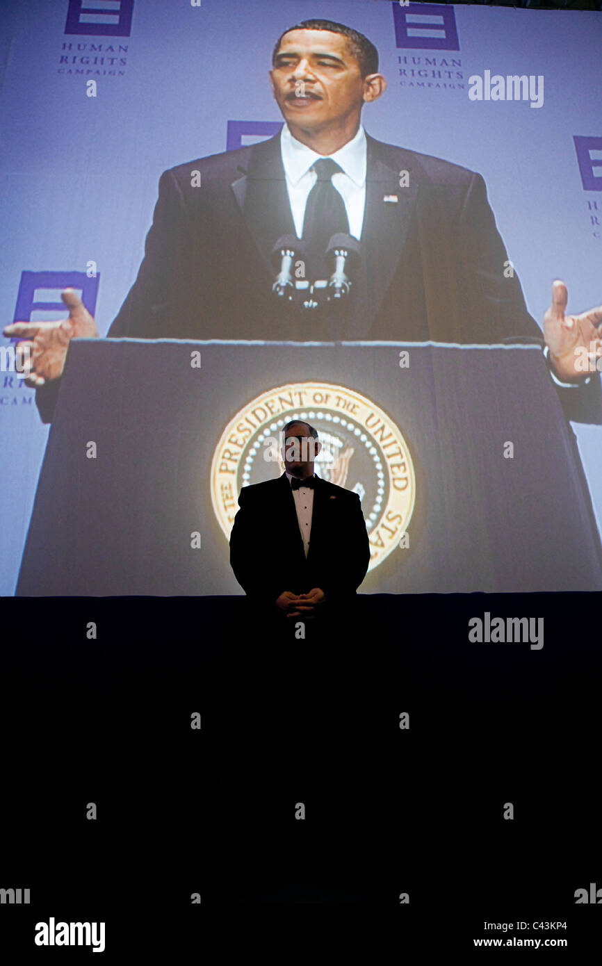 A United States Secret Service agent watches over the crowd, as ...