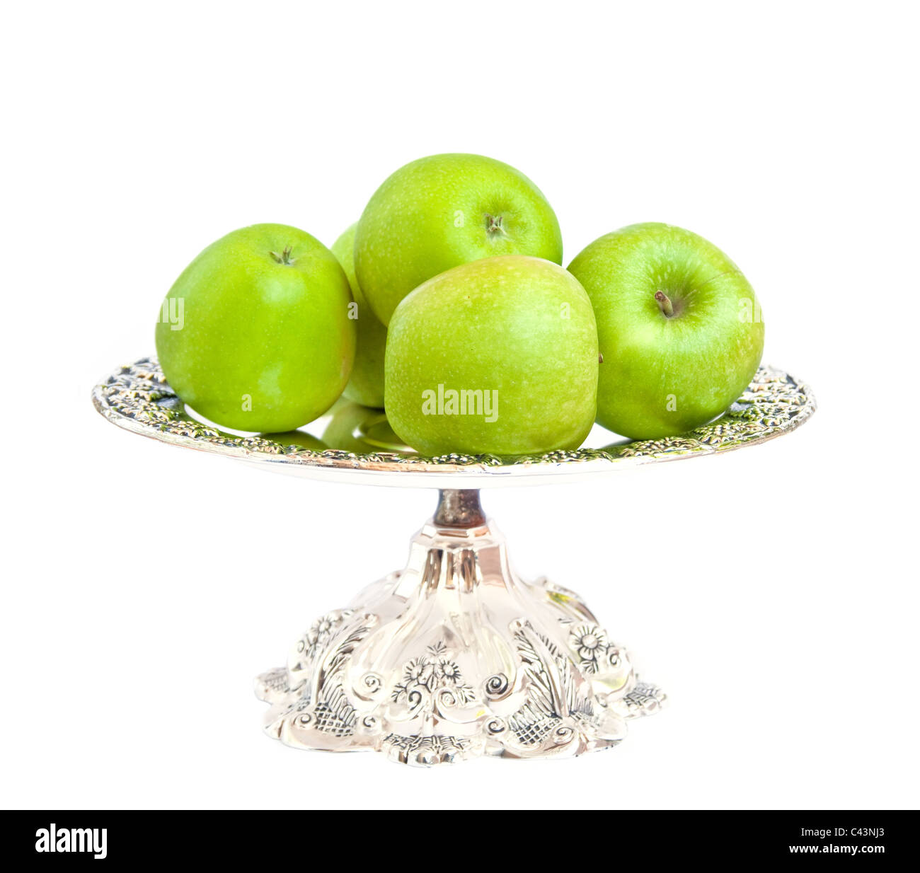 Green apples on a silver platter Stock Photo - Alamy