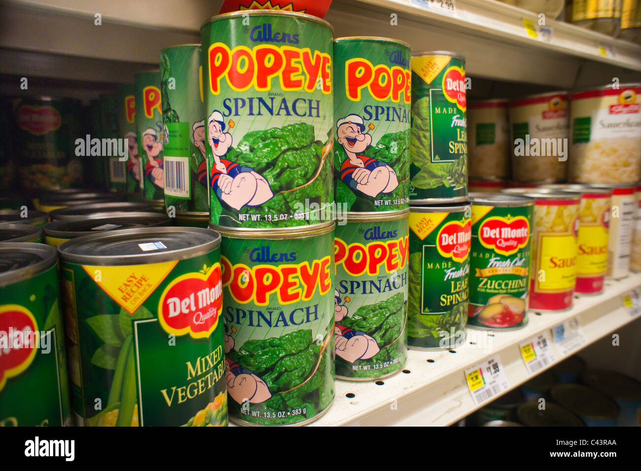 Cans of Popeye canned spinach are seen on a supermarket shelf in New ...