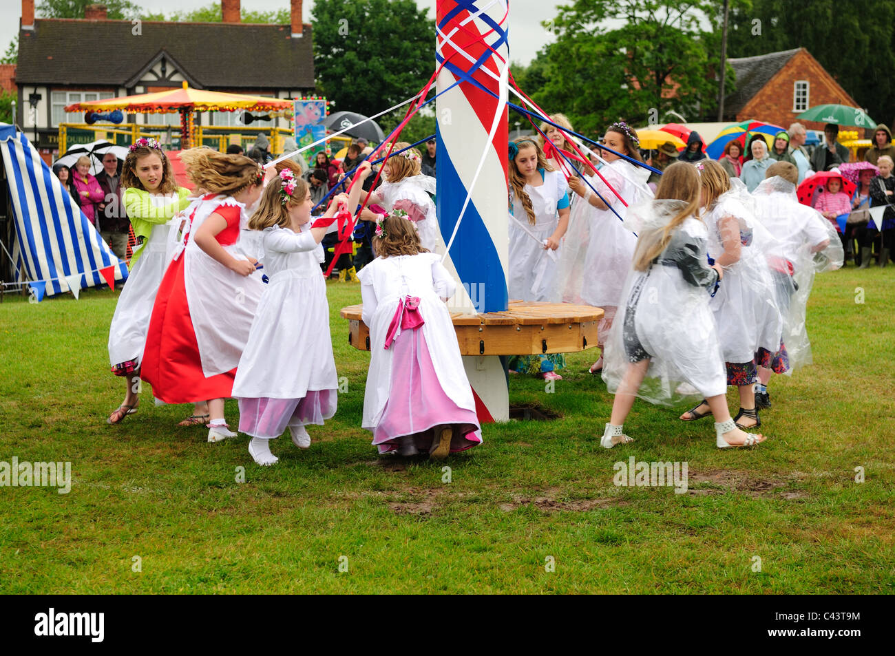 Mayday Festival ,Children Dancing Round The Maypole On An English ...
