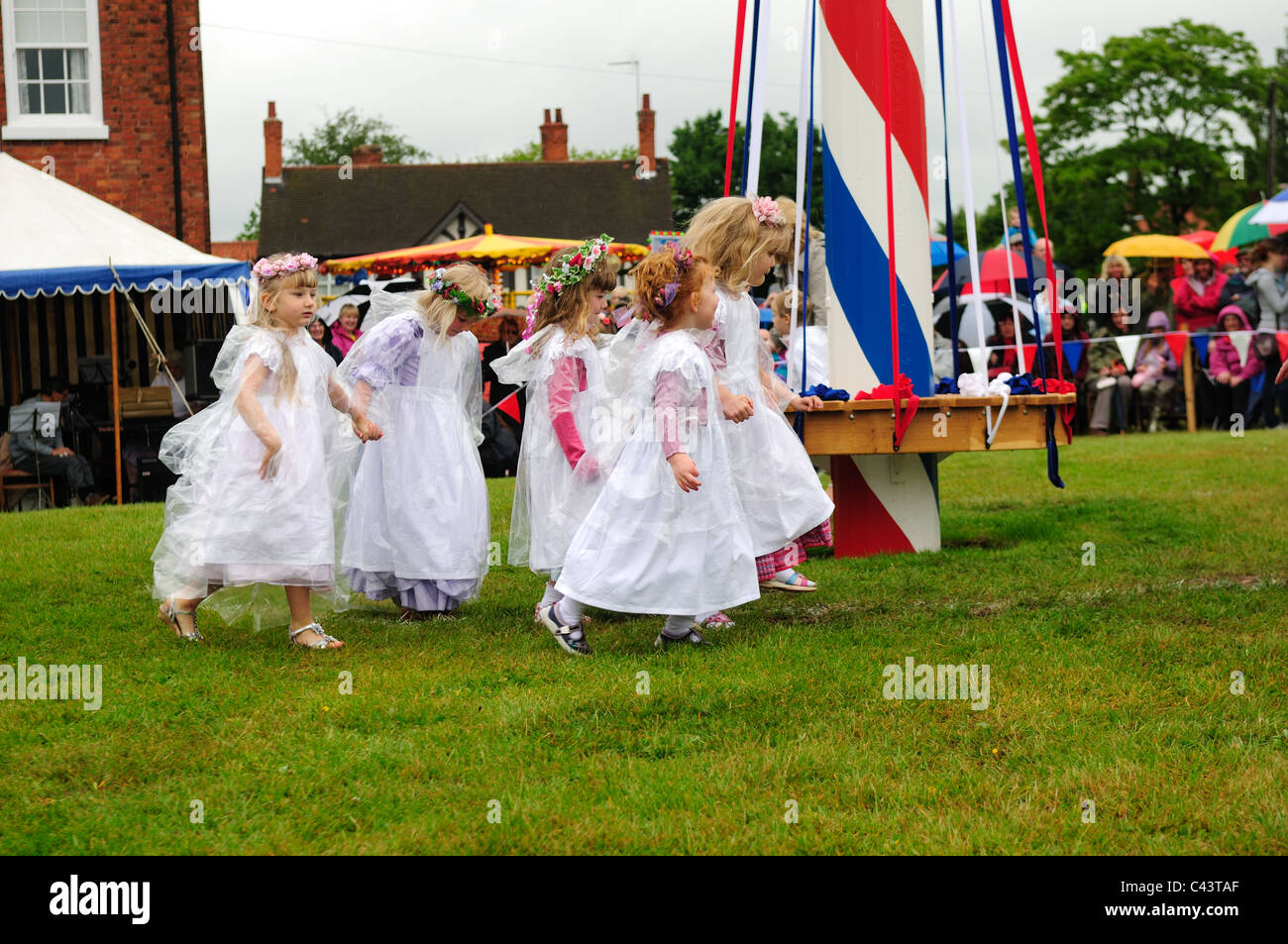 Dancing Round The Maypole On The Village Green High Resolution Stock ...