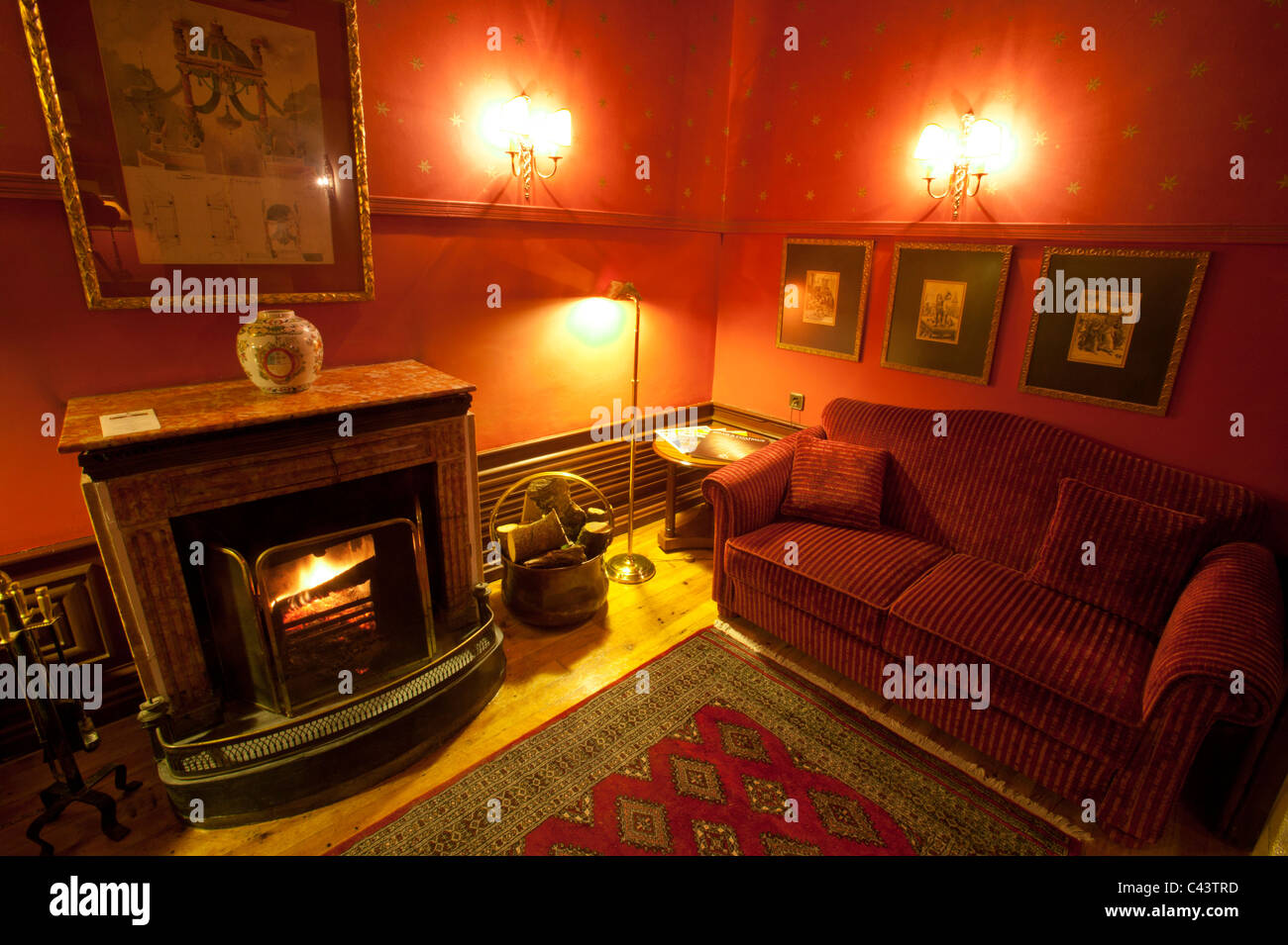 Cosy living room with fireplace Stock Photo - Alamy
