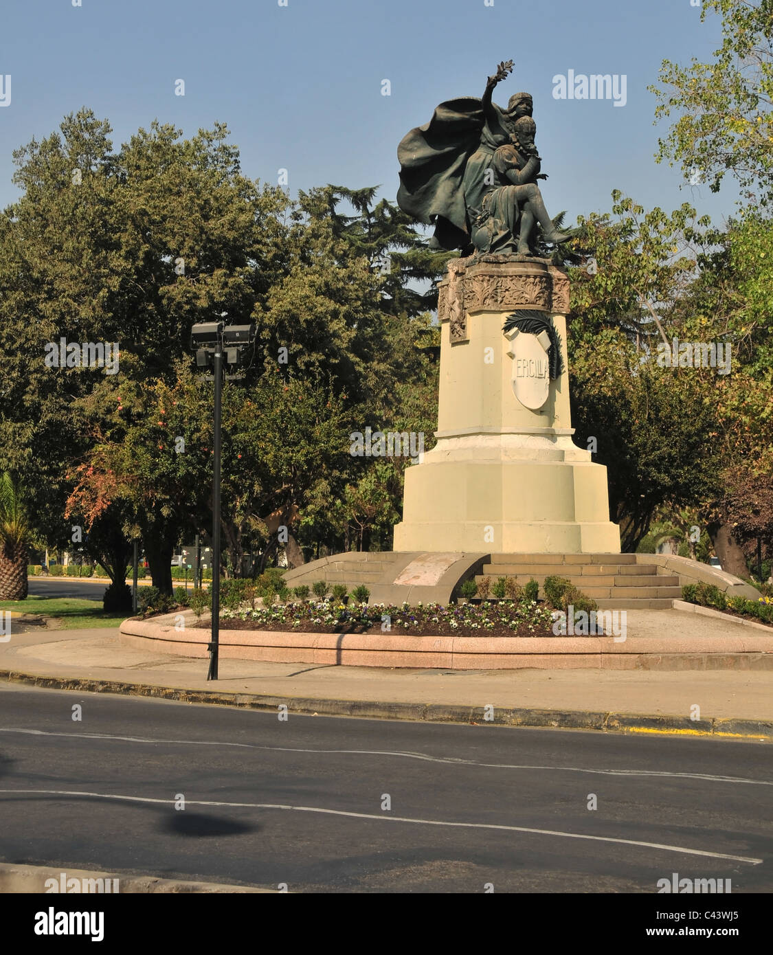 Blue sky green trees garden road view of Alonso de Ercilla Statue, Plaza Ercilla, Central ...