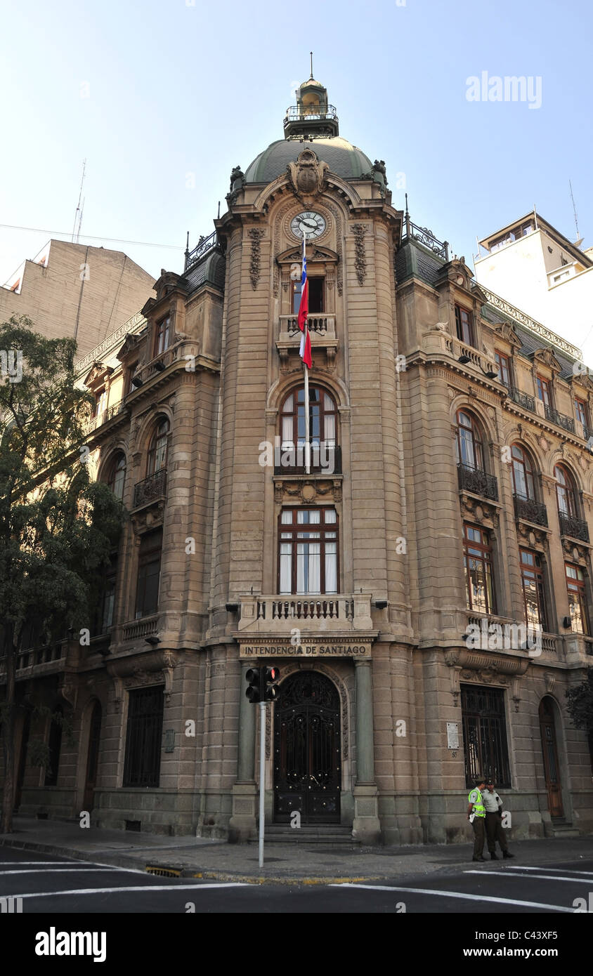 Blue sky neo-classical Intendencia de Santiago Building and 2 policemen ...