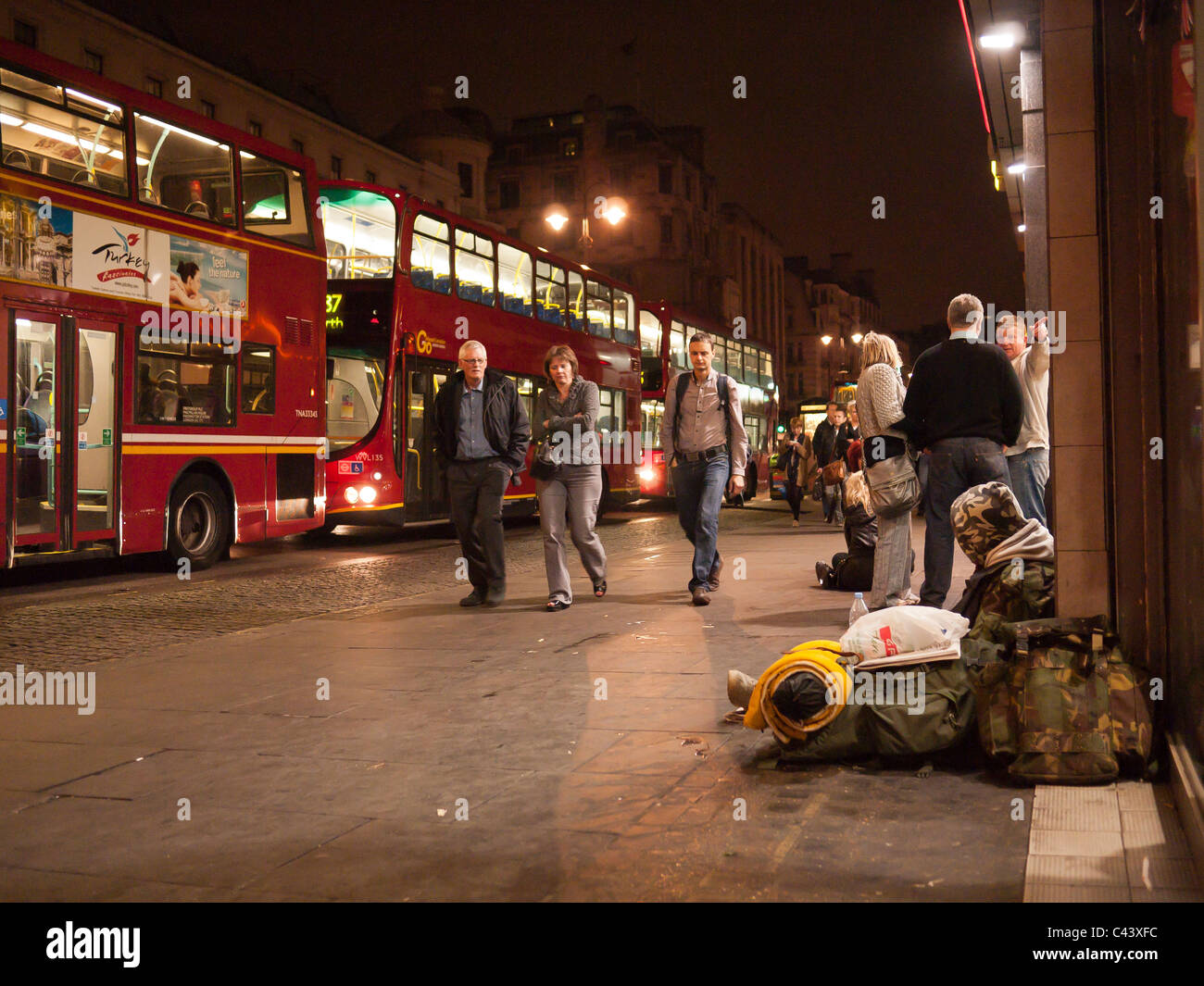 People walk past homeless people hi-res stock photography and images ...