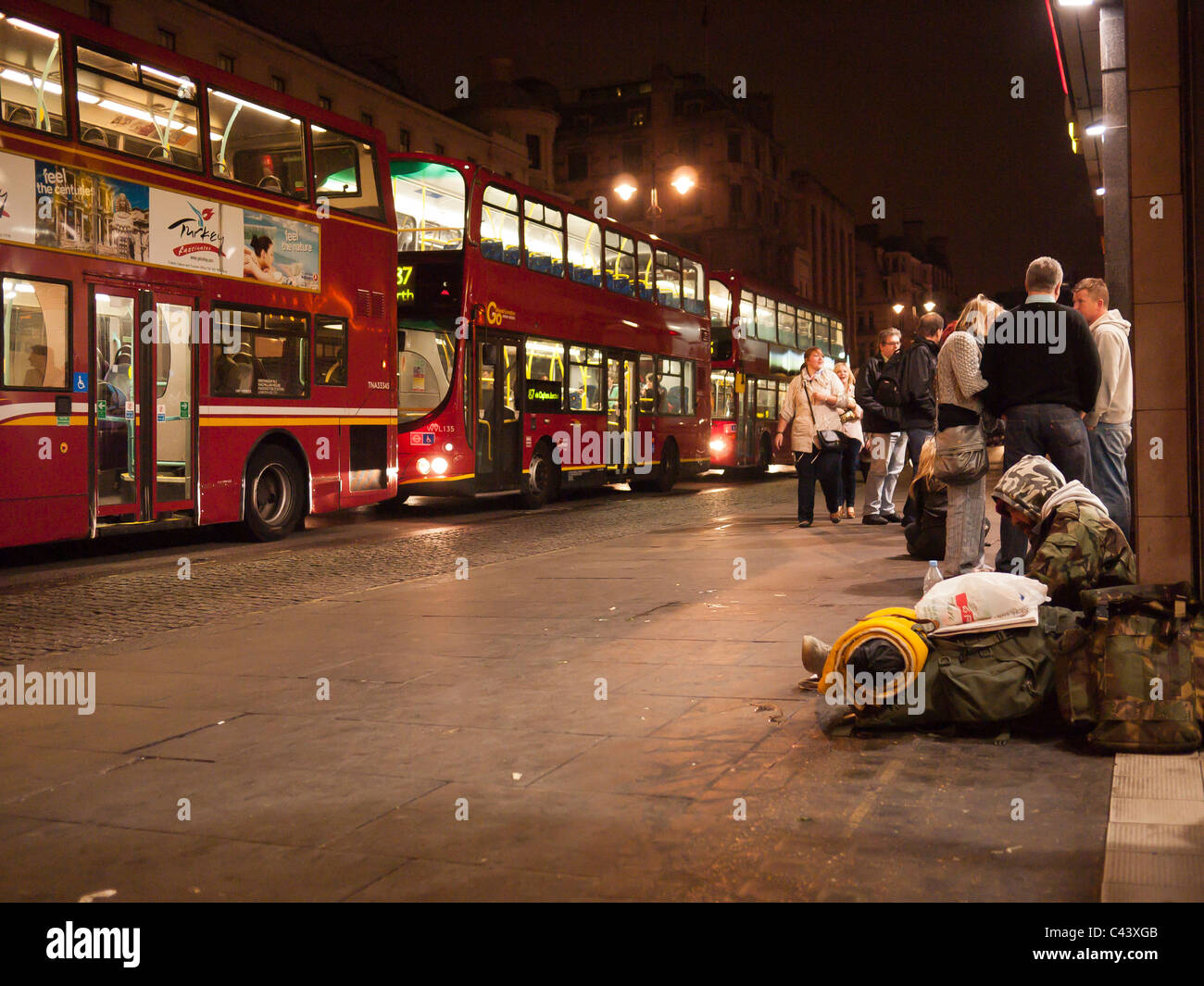 People walk past homeless people hi-res stock photography and images ...