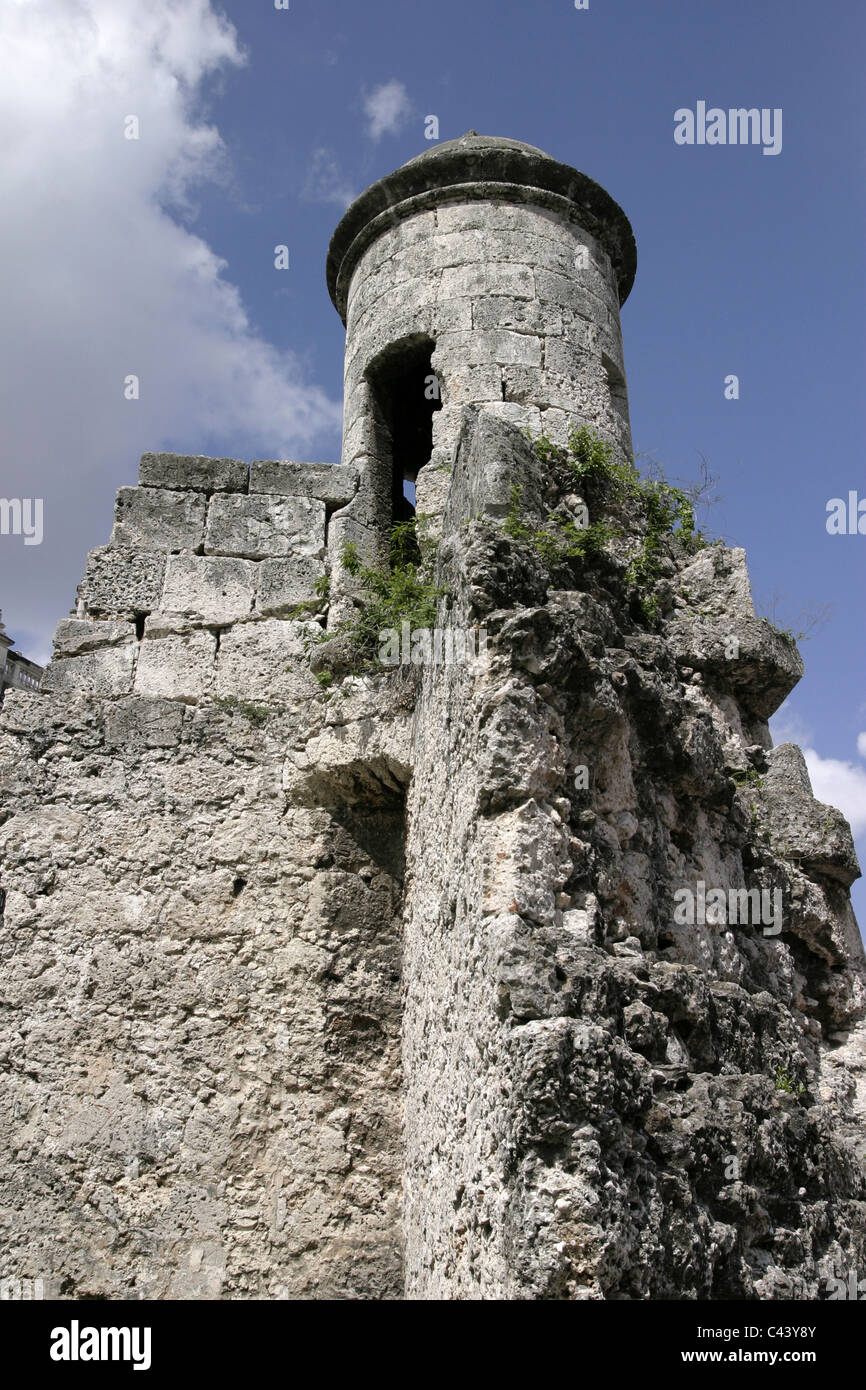 The image shows a famous Cuban Bell Tower, which is part of the ruins ...