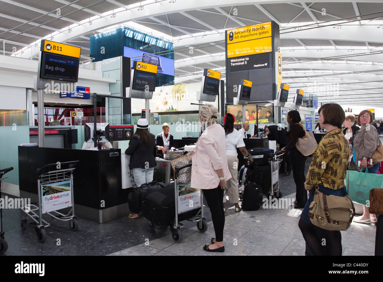 BA Check-in Queue - Terminal 5 - Heathrow Airport - London Stock Photo ...
