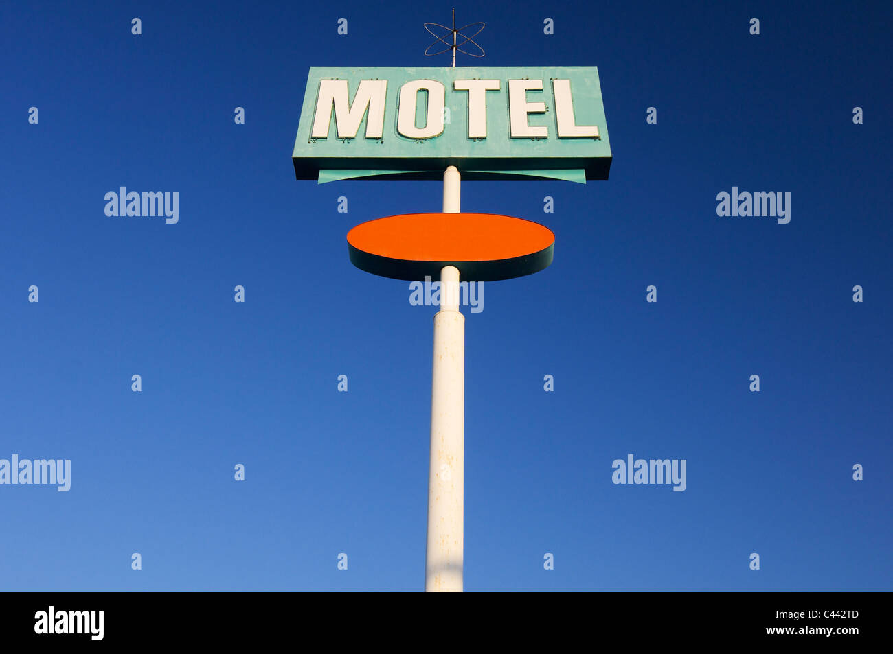 poster green motel with blue sky Stock Photo - Alamy