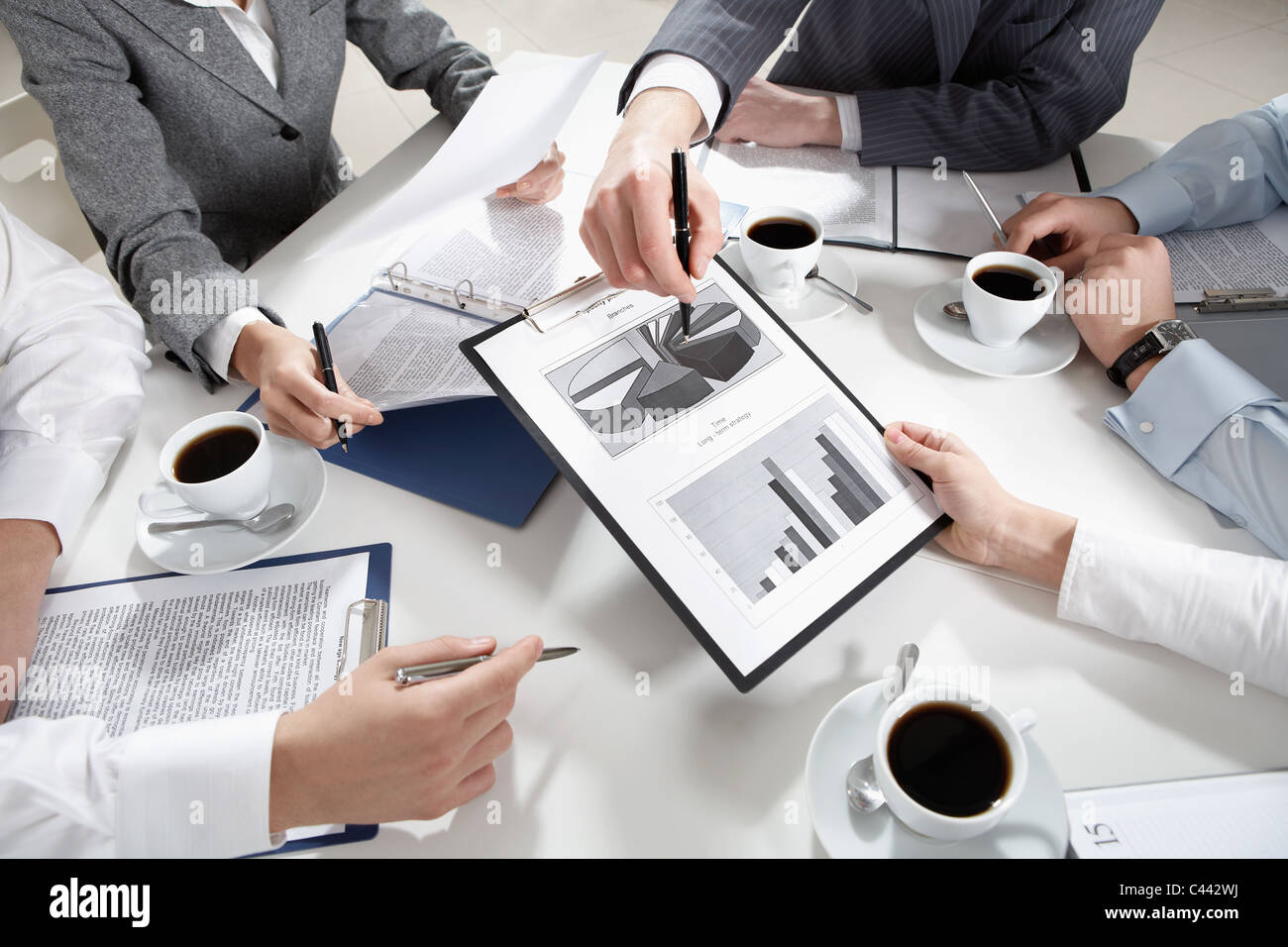 Image of human hands during discussion of business plans Stock Photo ...
