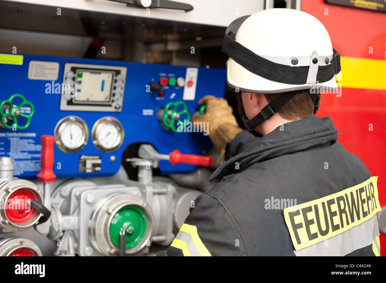 Picture from a young and successful firefighter at work Stock Photo - Alamy