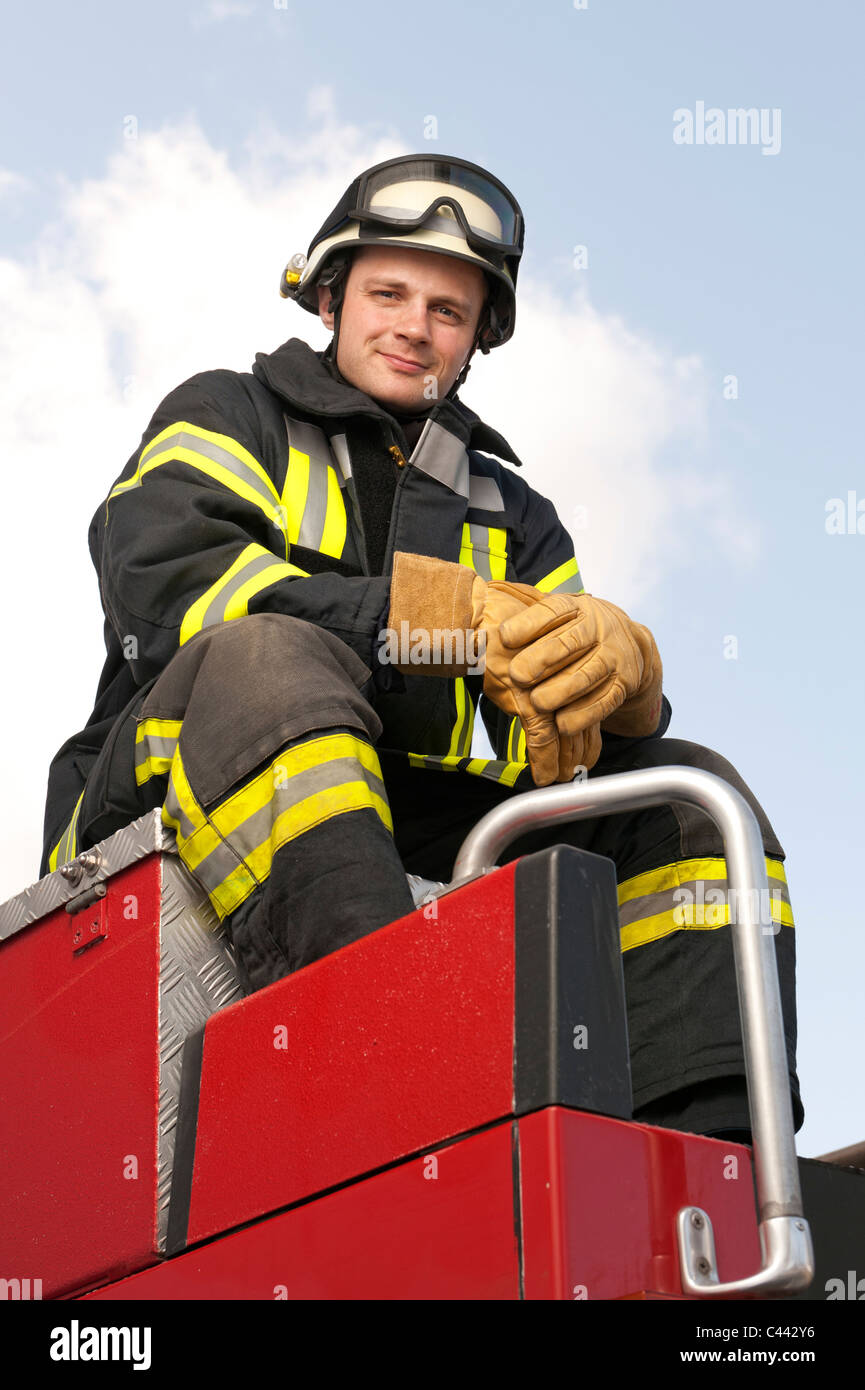 Picture from a young and successful firefighter at work Stock Photo - Alamy