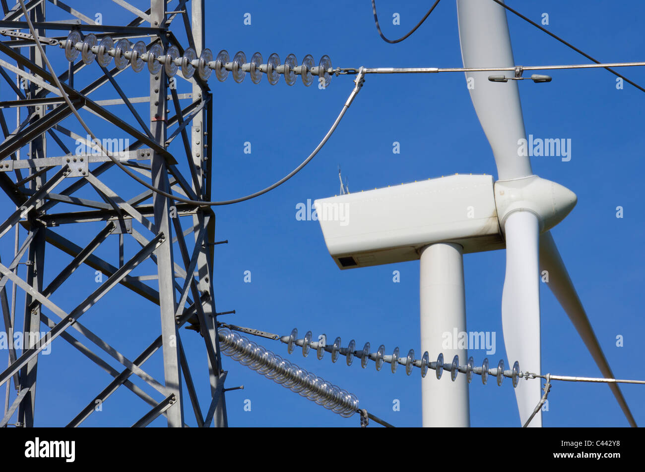 windmill and power line with blue and clear sky Stock Photo - Alamy