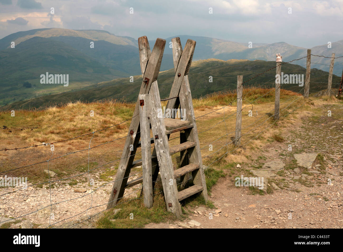 Ladder-type wooden stile over a fence in the Lake District UK Stock ...