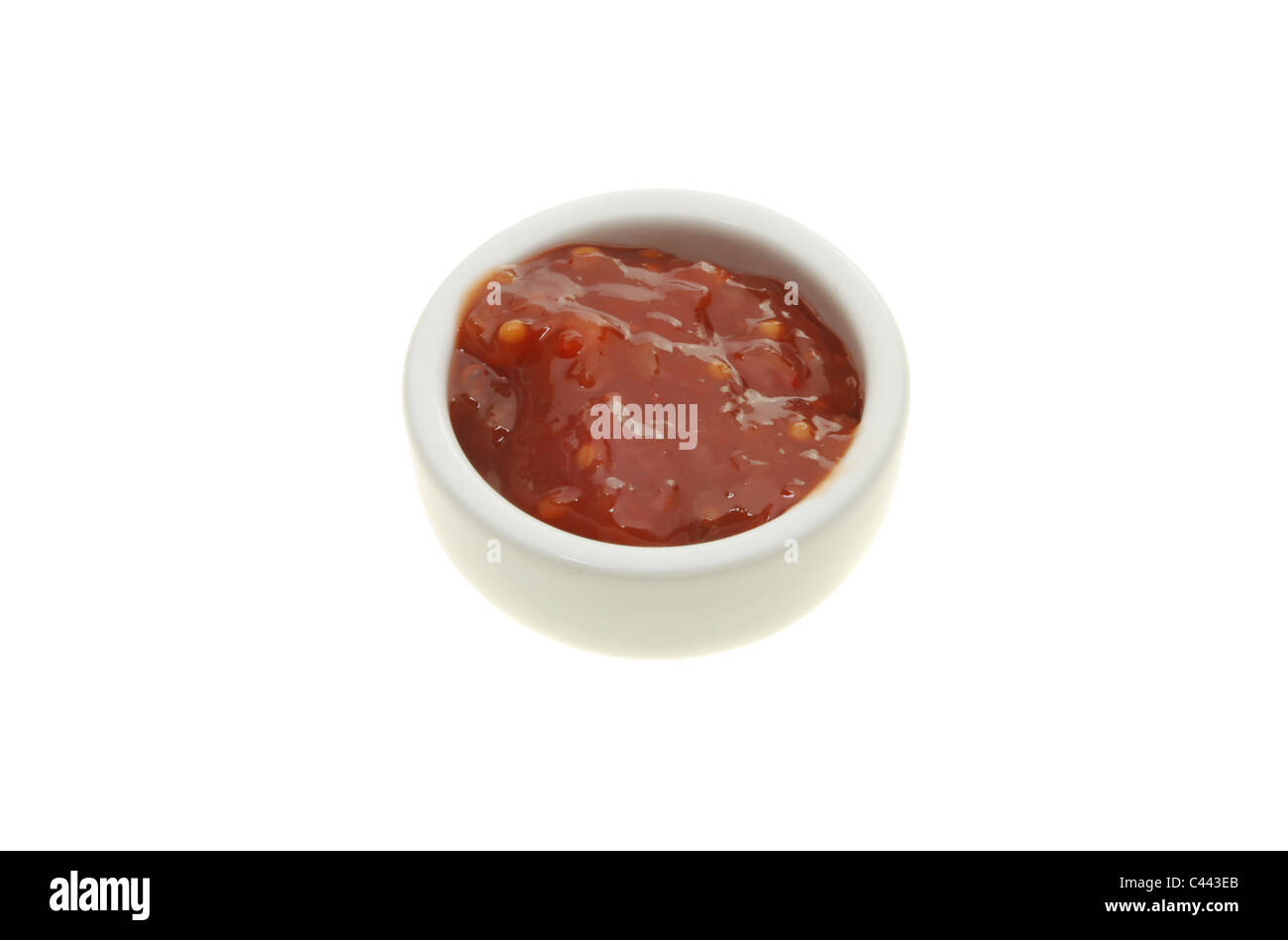 Tomato relish in a ramekin isolated against white Stock Photo - Alamy