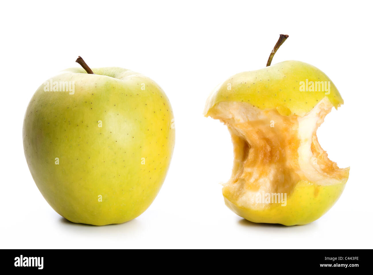 an apple and an apple core in front of white background Stock Photo - Alamy