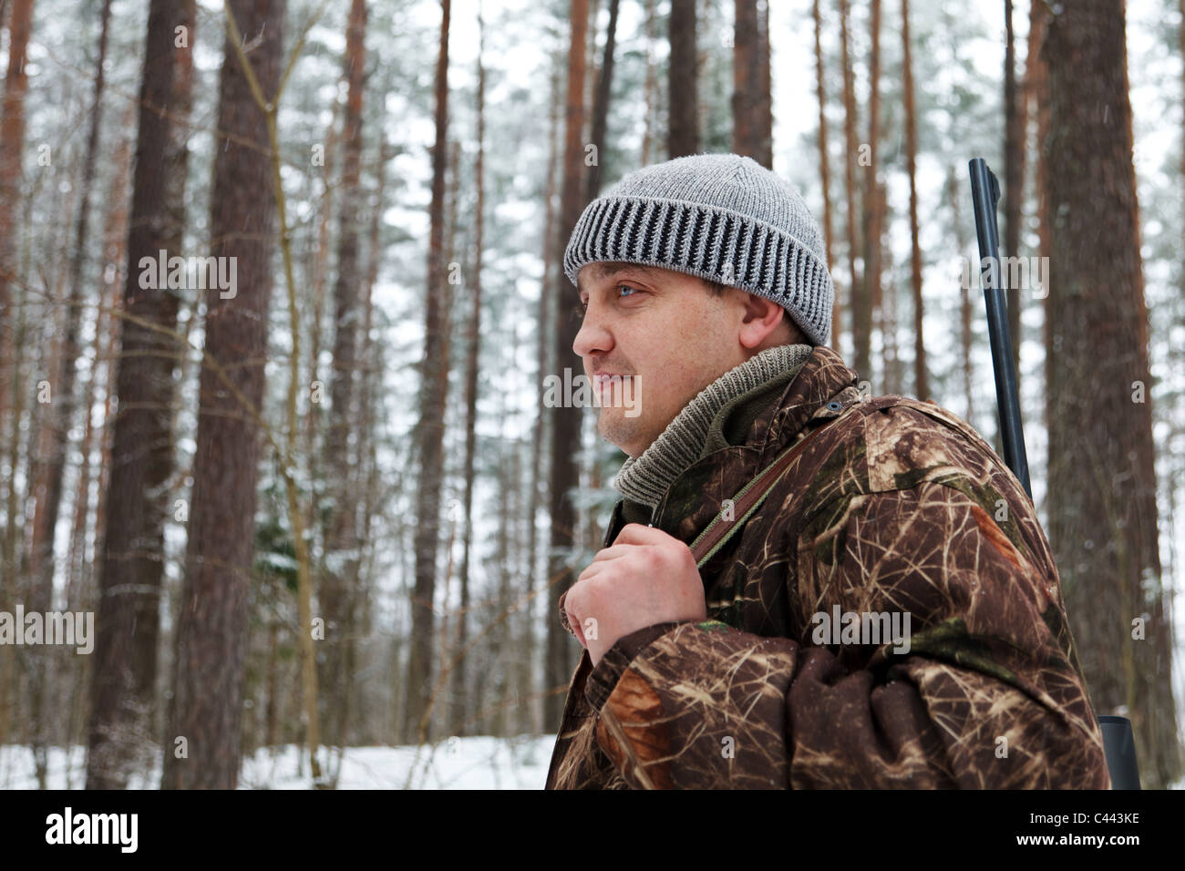 Hunter portrait at winter forest Stock Photo - Alamy