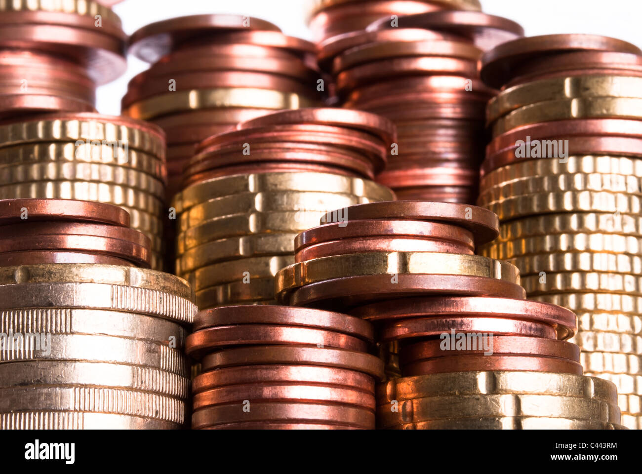 many coin piles of eurocoins stand side by side Stock Photo - Alamy