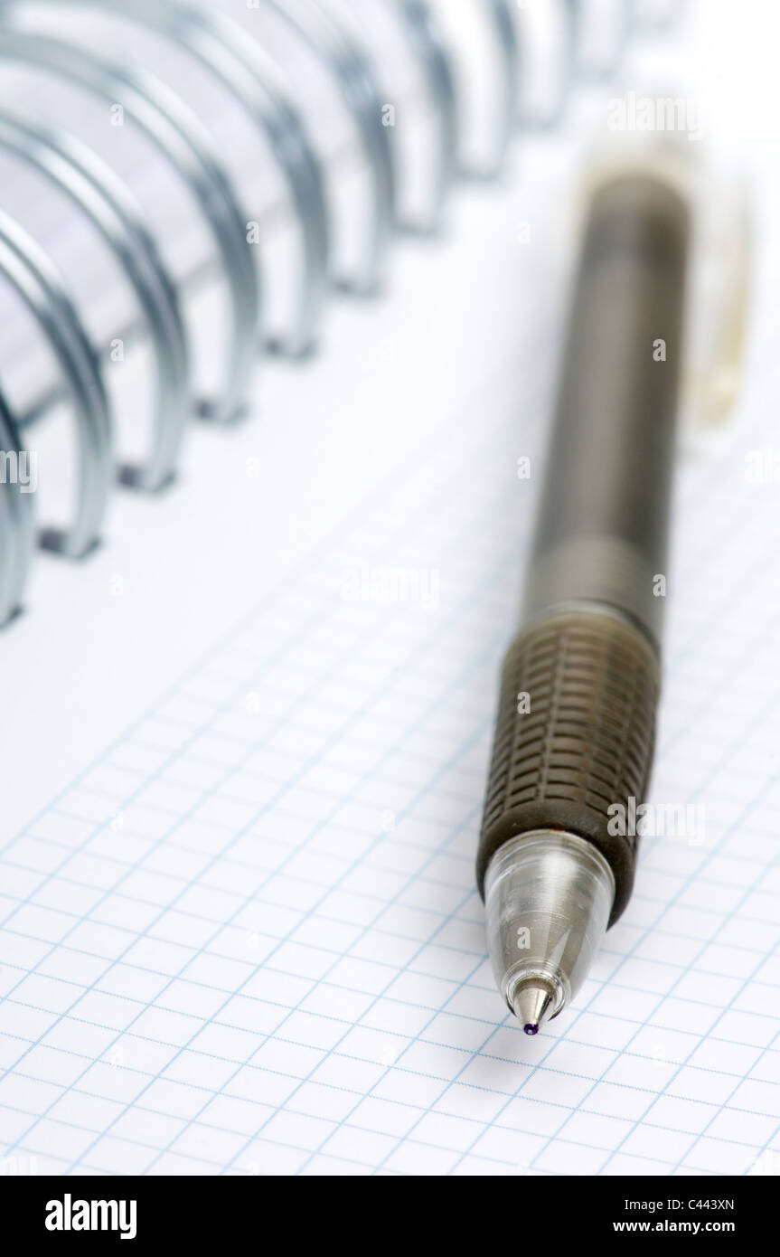 foreground of a pen and a spiral notebook Stock Photo - Alamy